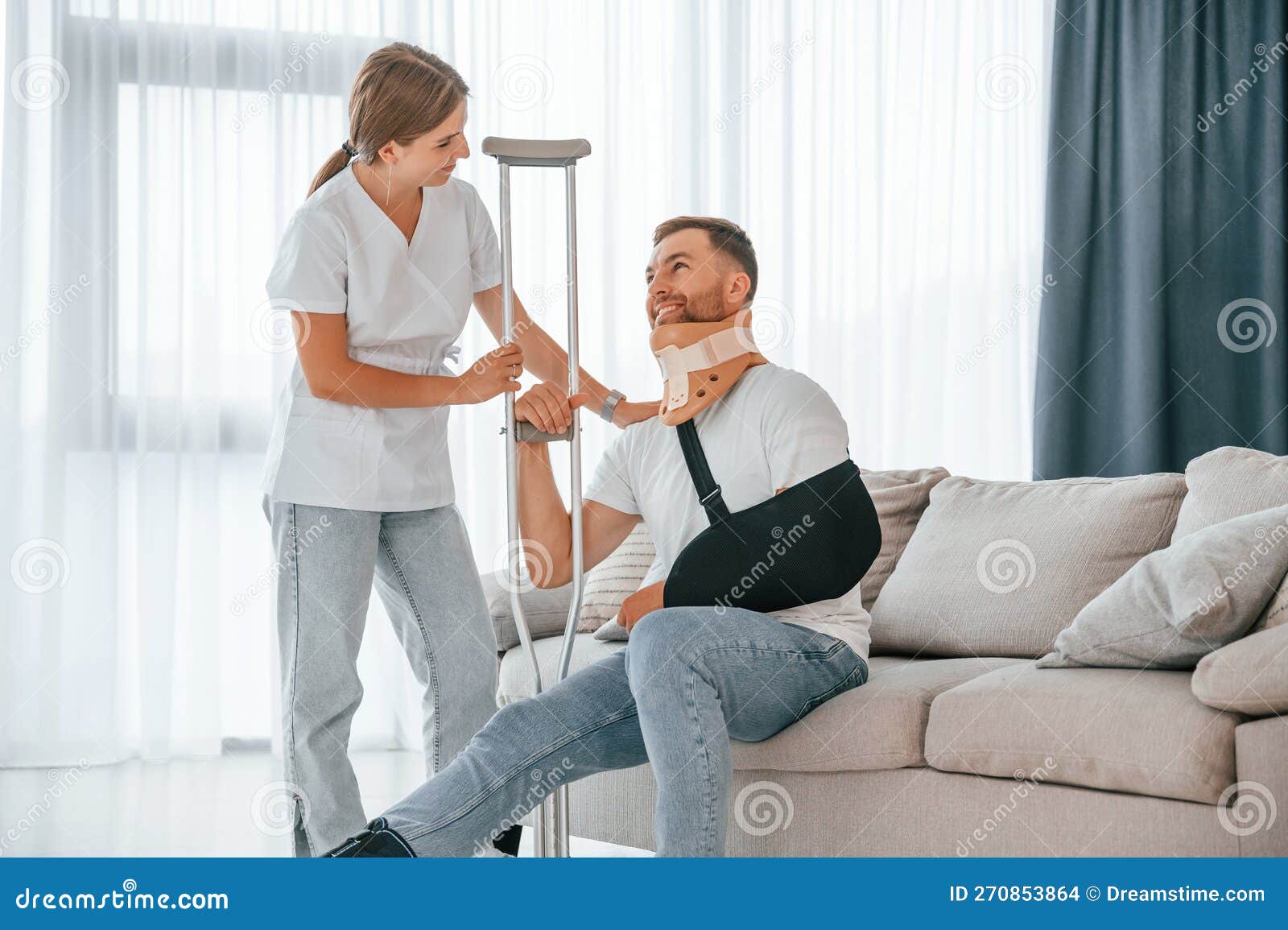Nurse is Helping Injured Man at Home Stock Photo - Image of home ...