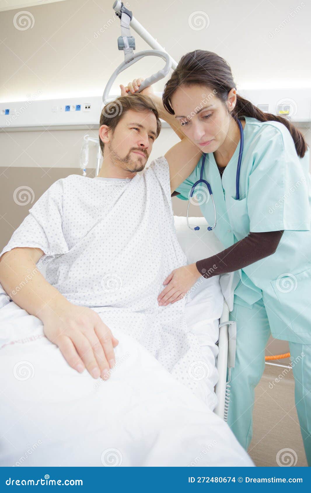 Nurse Helping Sick Male Patient Lying on Bed Stock Photo - Image of ...