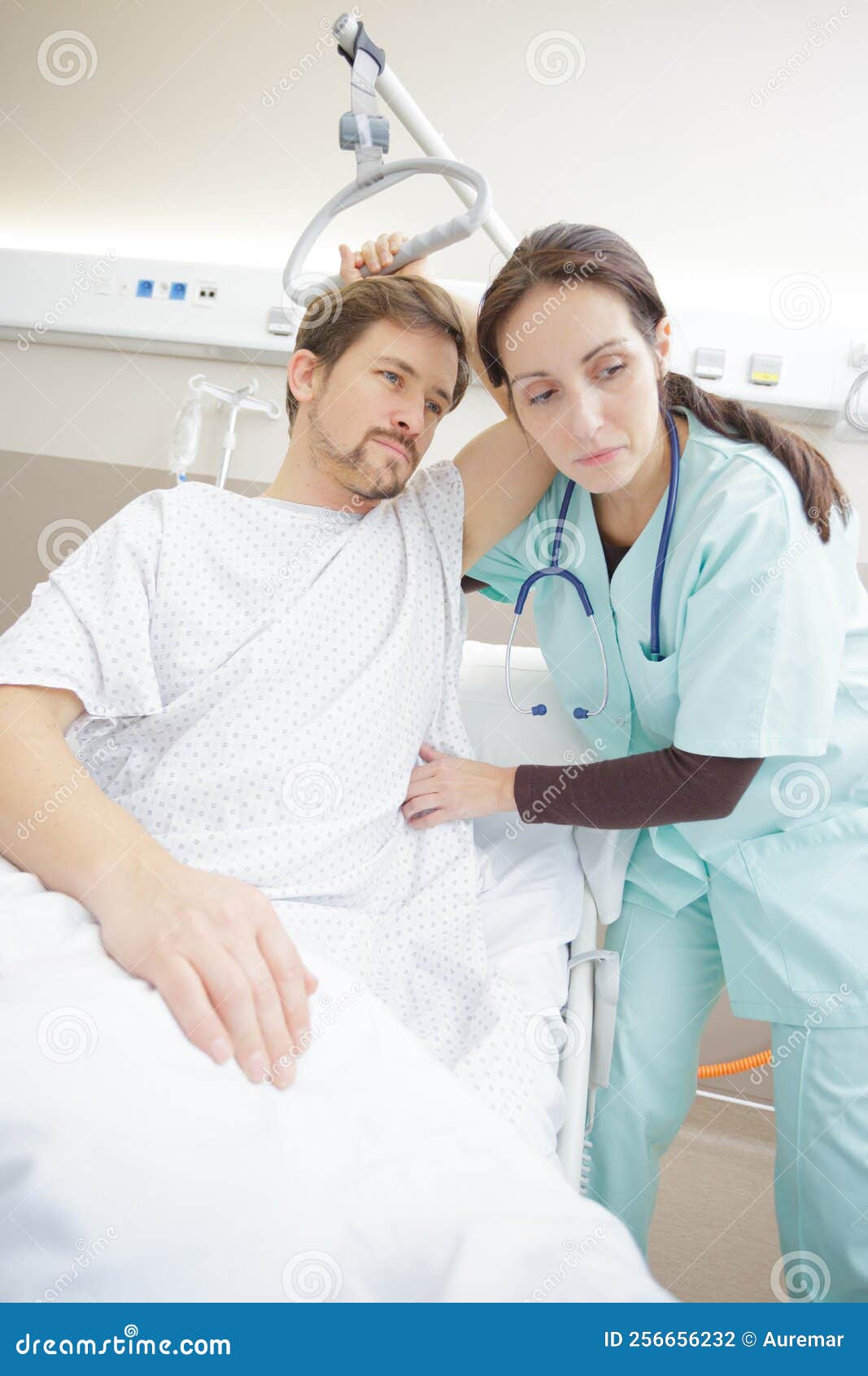 Nurse Helps Sick Male Patient Out Bed Stock Photo - Image of ...