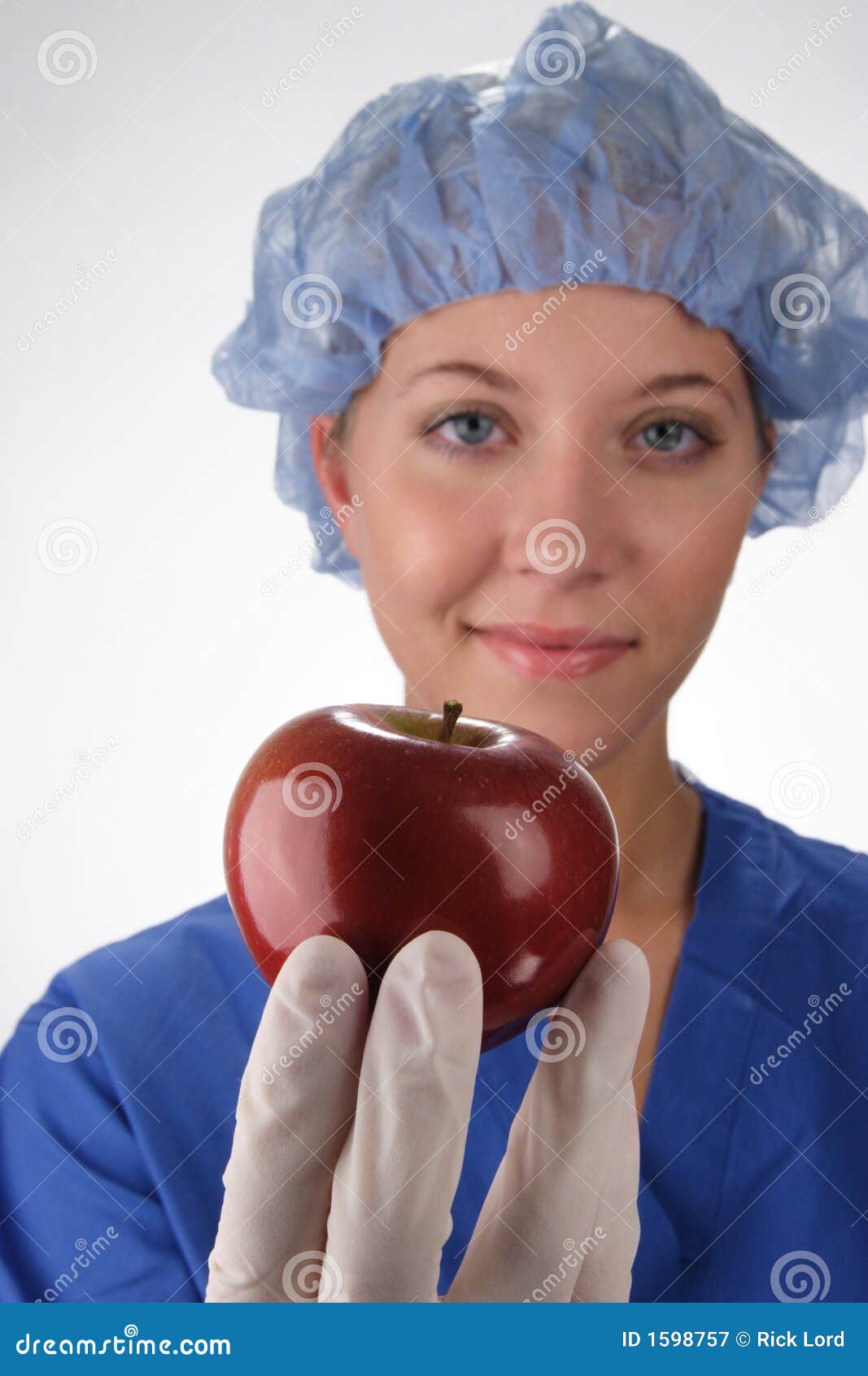 Nurse Holding Apple stock image. Image of hospital, dental - 1598757