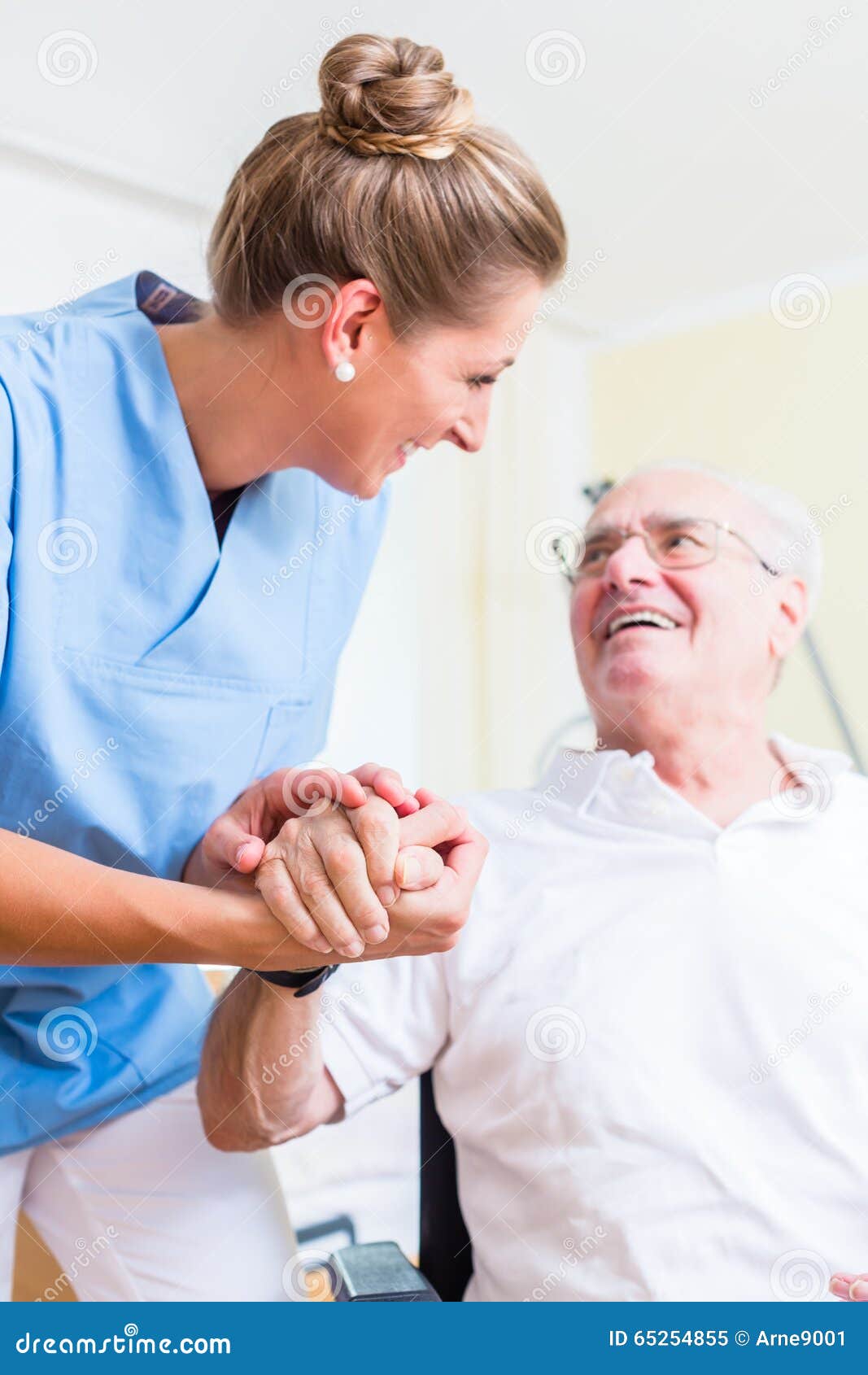 Nurse Holding Hand of Senior Man in Rest Home Stock Image - Image of ...