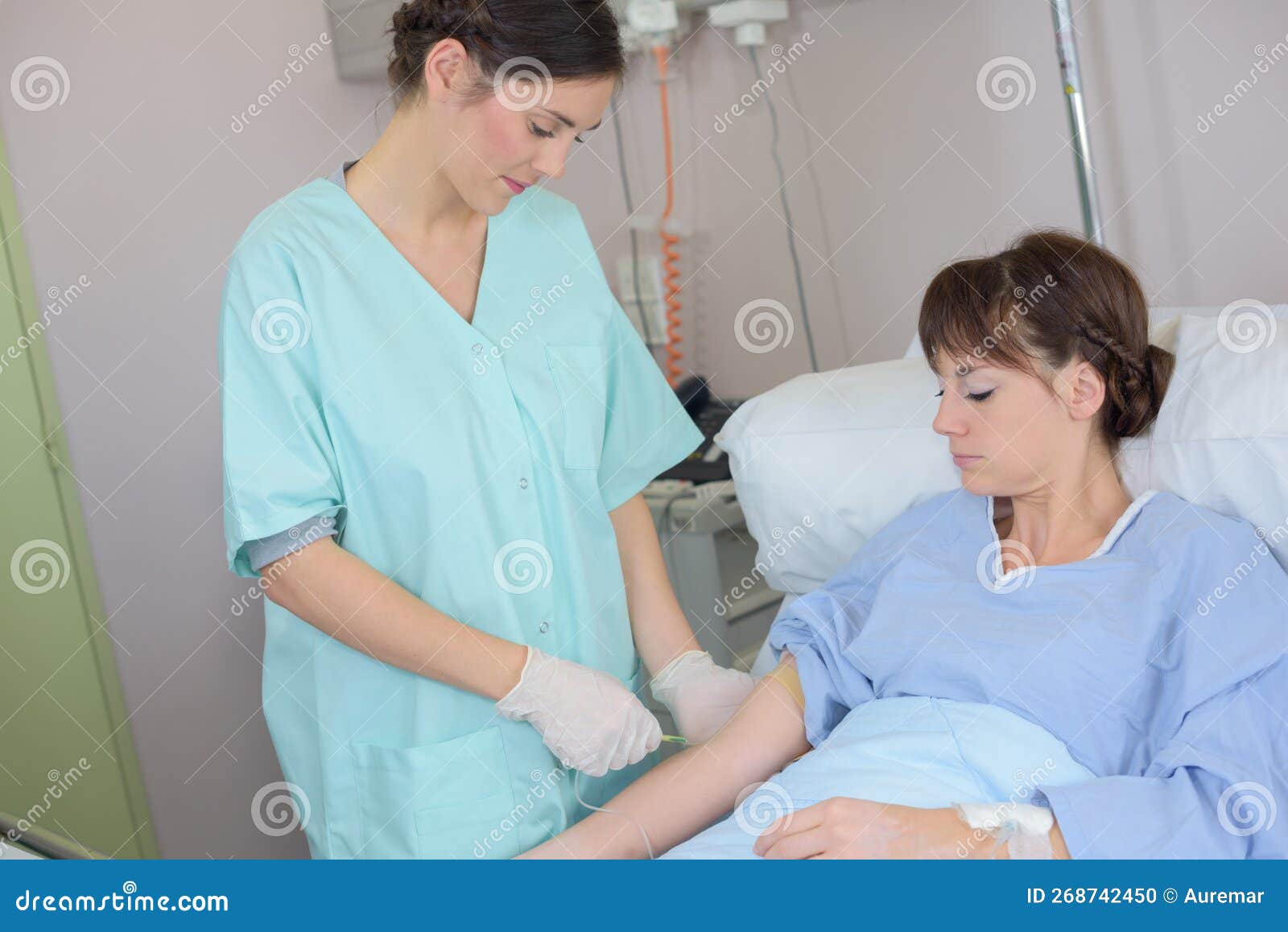 Nurse inserting needle stock photo. Image of anatomy - 268742450