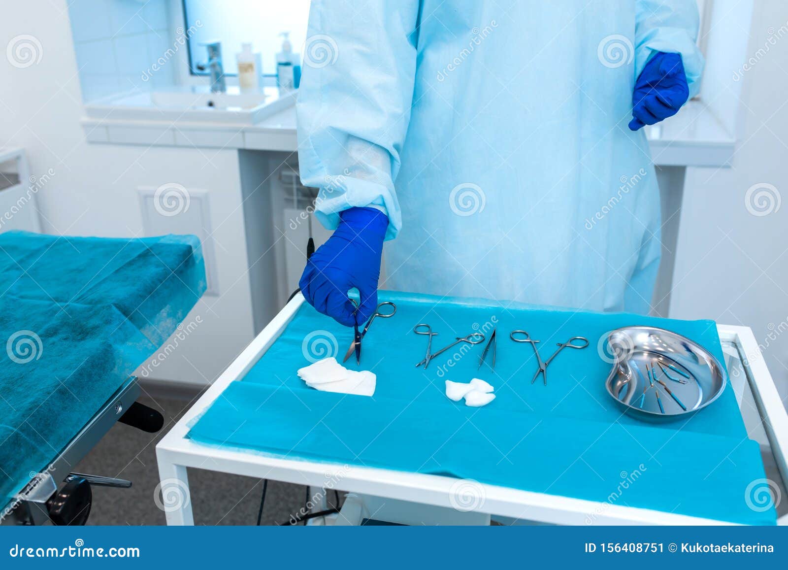 The Nurse is Laying Out a Sterile Instrument for Operating on the Table ...