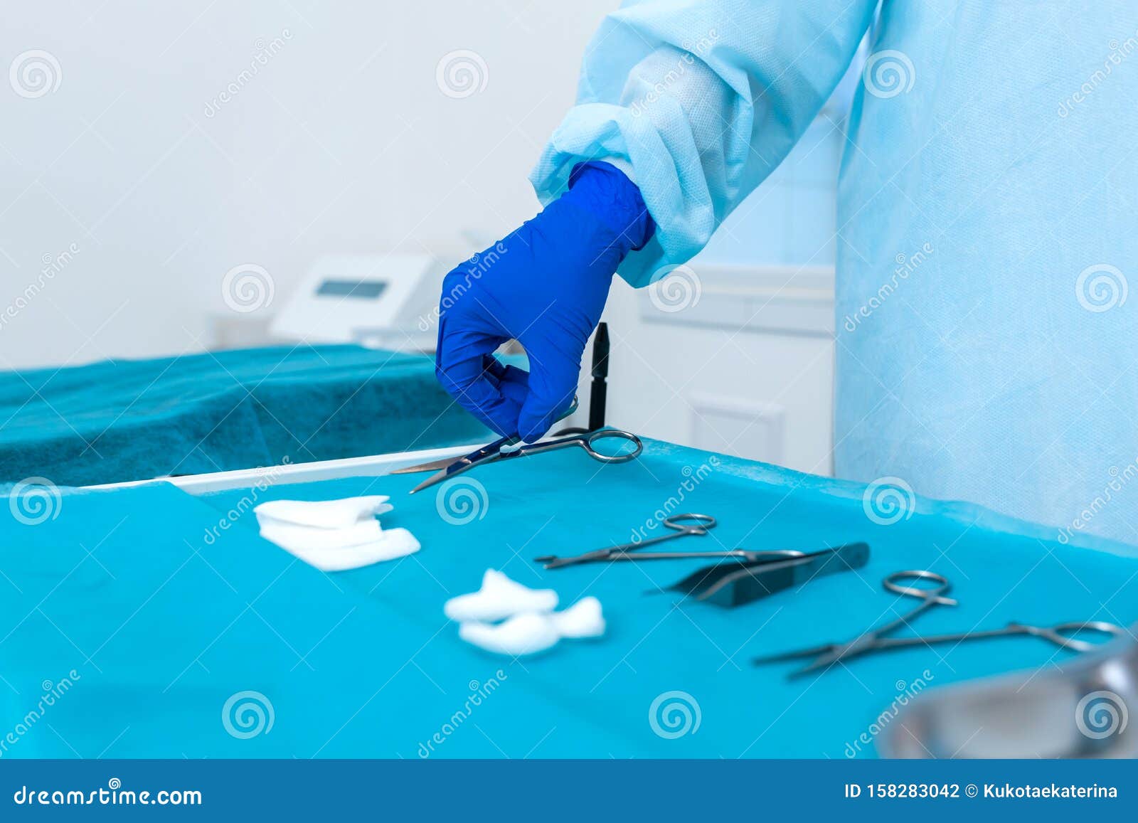 The Nurse is Laying Out a Sterile Instrument for Operating on the Table ...