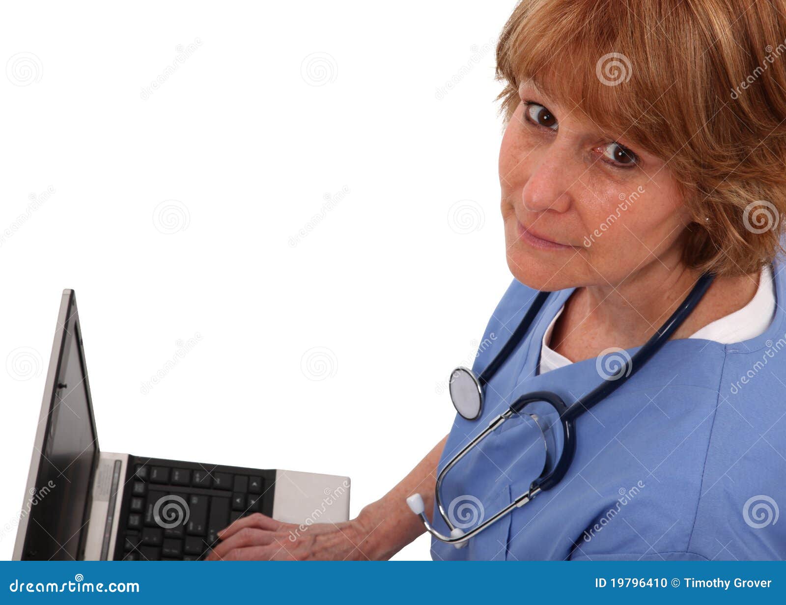 Nurse Looking Up while on Laptop Stock Photo - Image of white, clinic ...