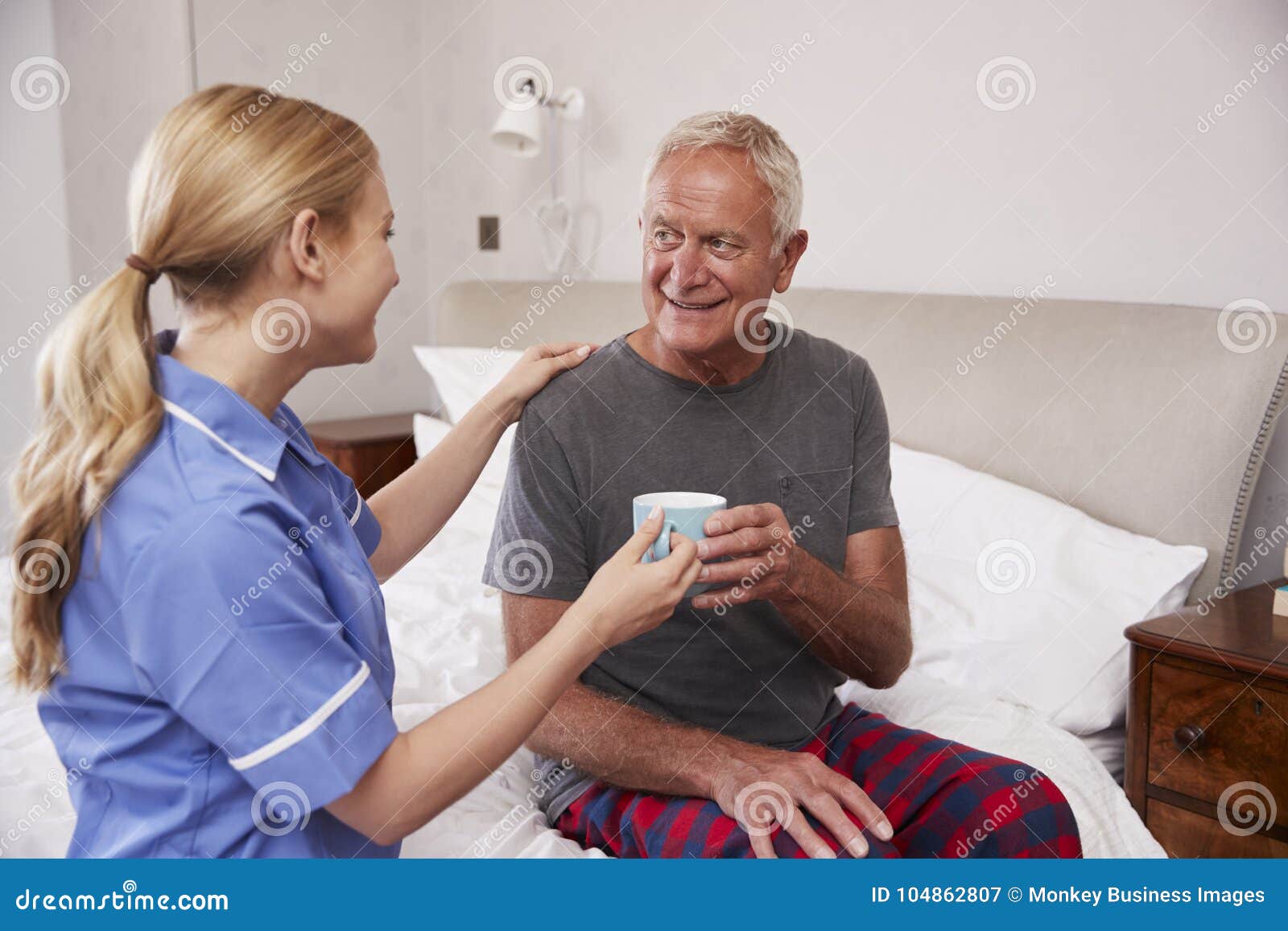 Nurse Making Home Visit To Senior Man in Bed Stock Image - Image of ...