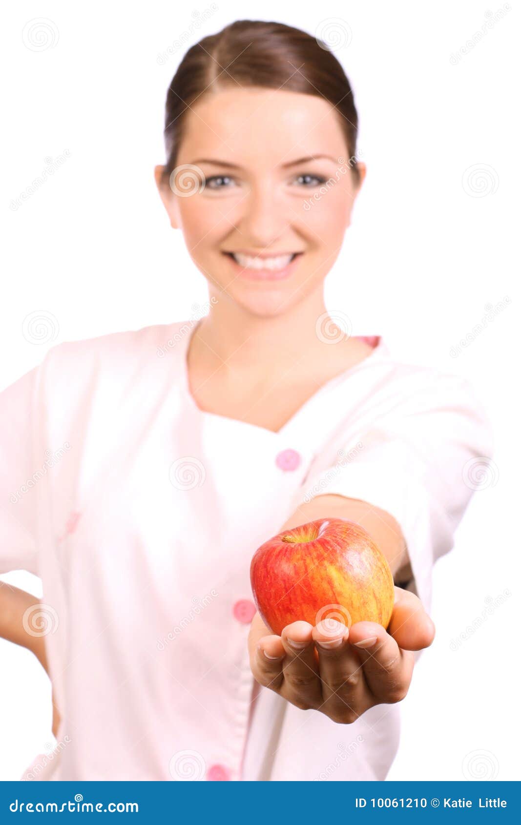 Nurse offering an apple stock photo. Image of doctor - 10061210