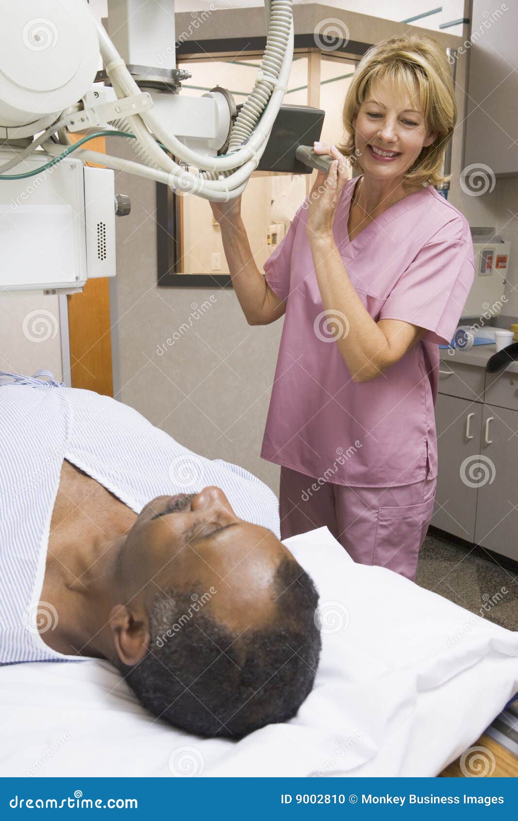 Nurse with Patient Having an X-Ray Stock Photo - Image of gown, medical ...