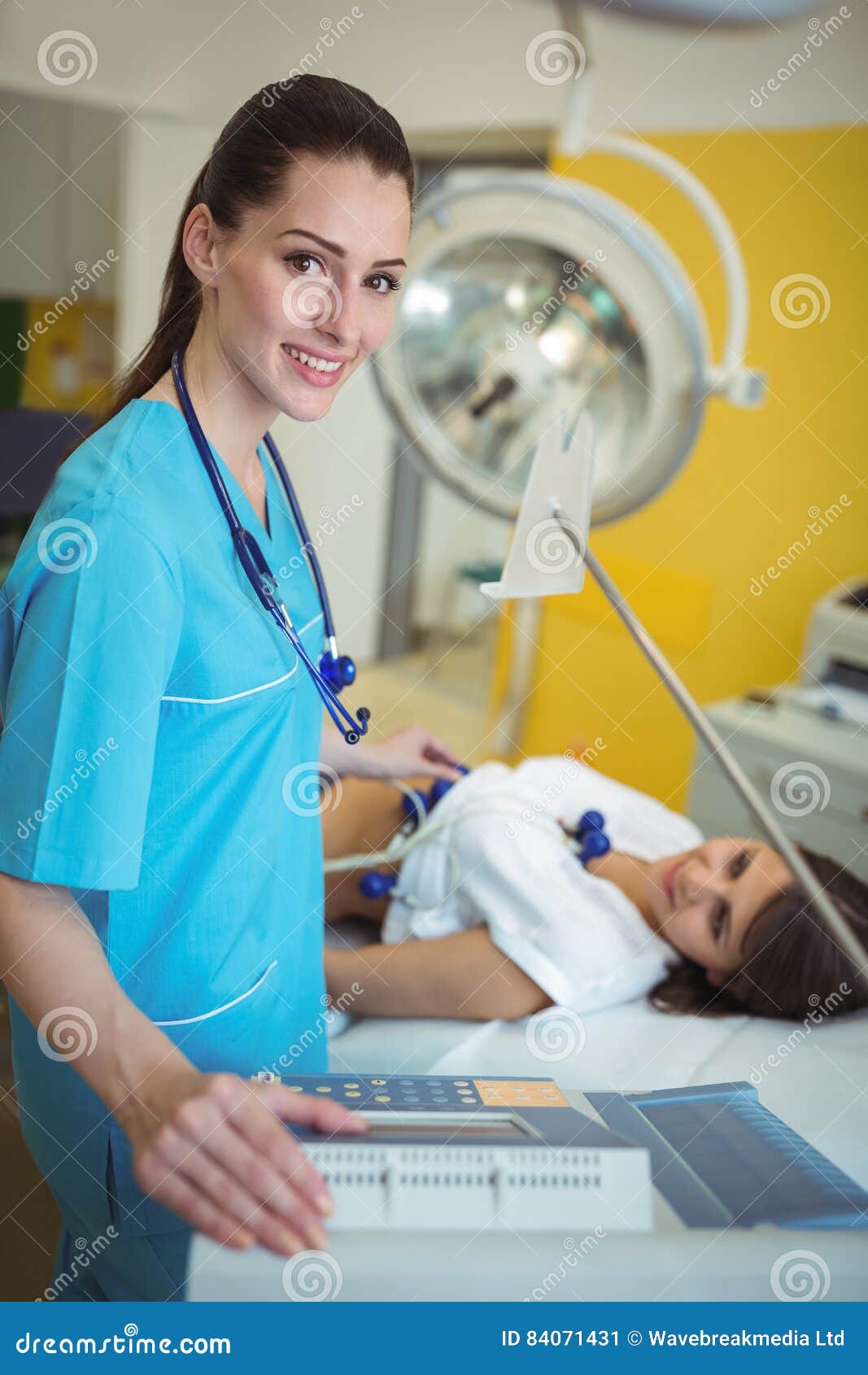 Nurse Performing an Electrocardiogram Test on the Patient Stock Image ...