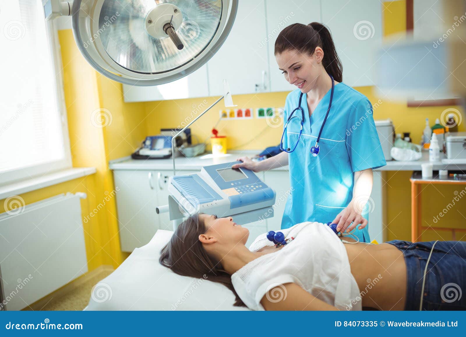 Nurse Performing an Electrocardiogram Test on the Patient Stock Image ...