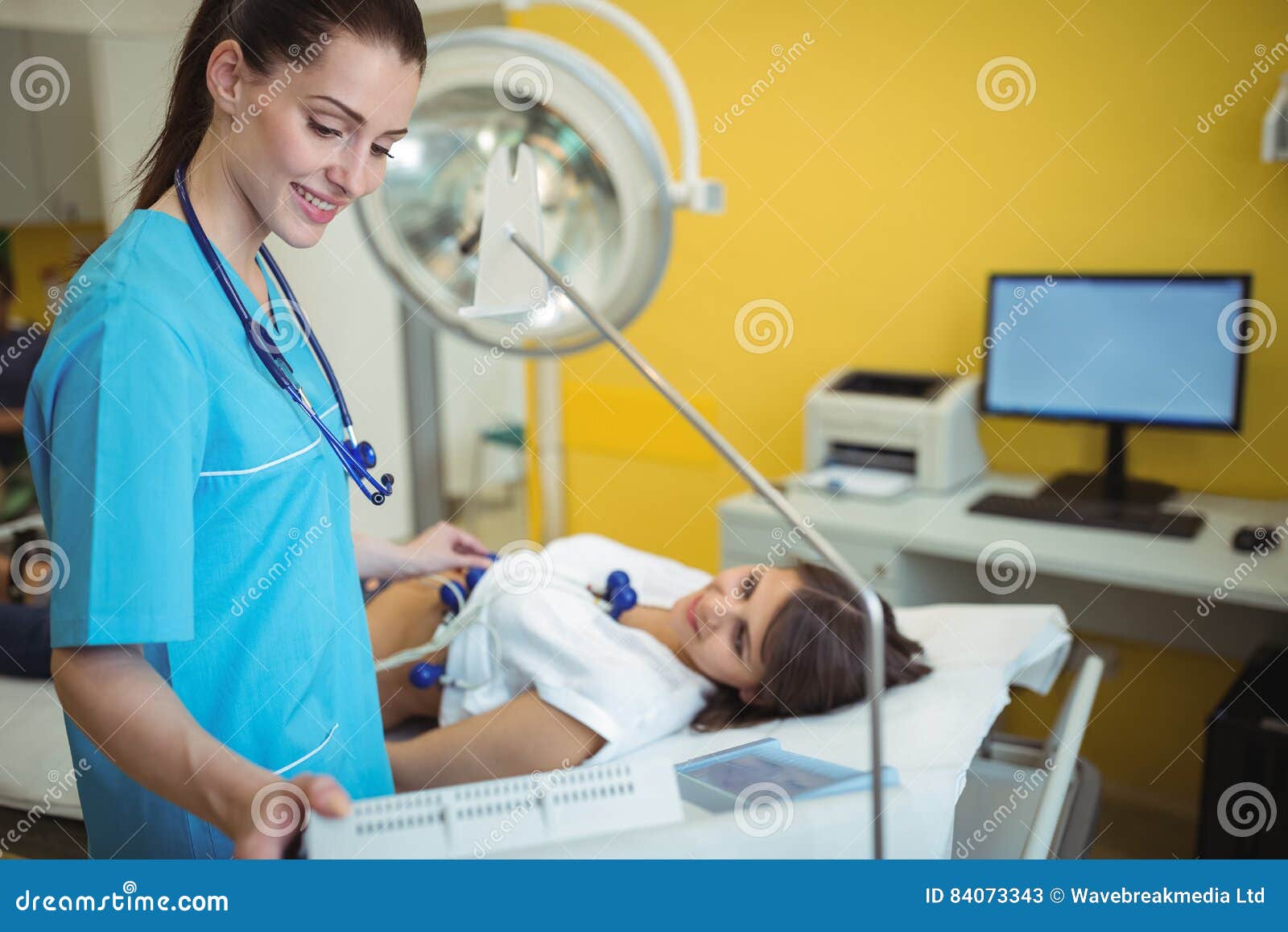 Nurse Performing an Electrocardiogram Test on the Patient Stock Image ...