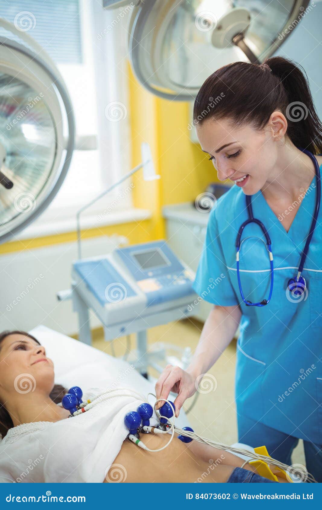 Nurse Performing an Electrocardiogram Test on the Patient Stock Photo ...