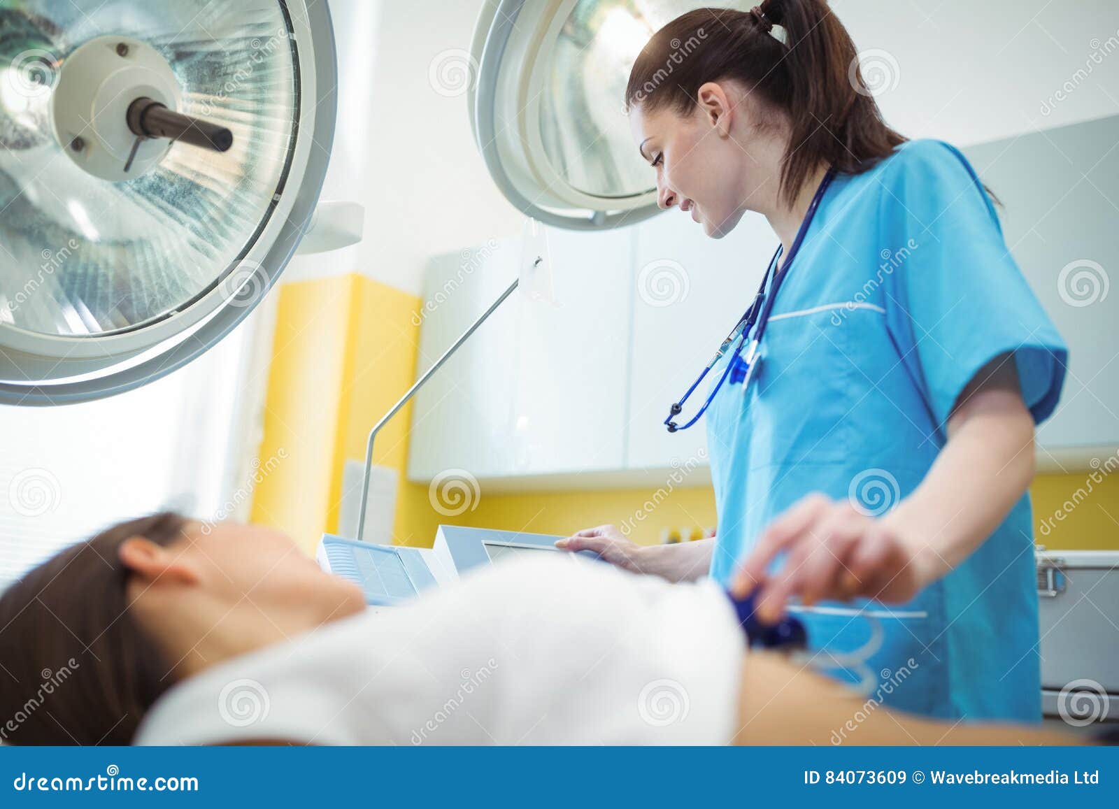 Nurse Performing an Electrocardiogram Test on the Patient Stock Image ...