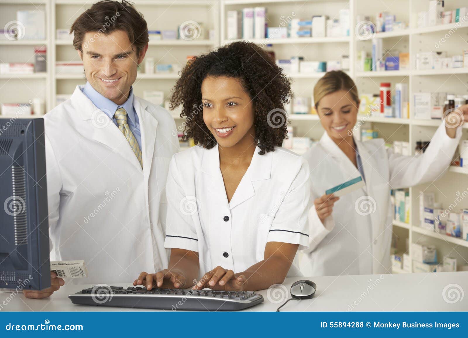 Nurse and Pharmacists Working in Pharmacy Stock Photo - Image of mixed ...