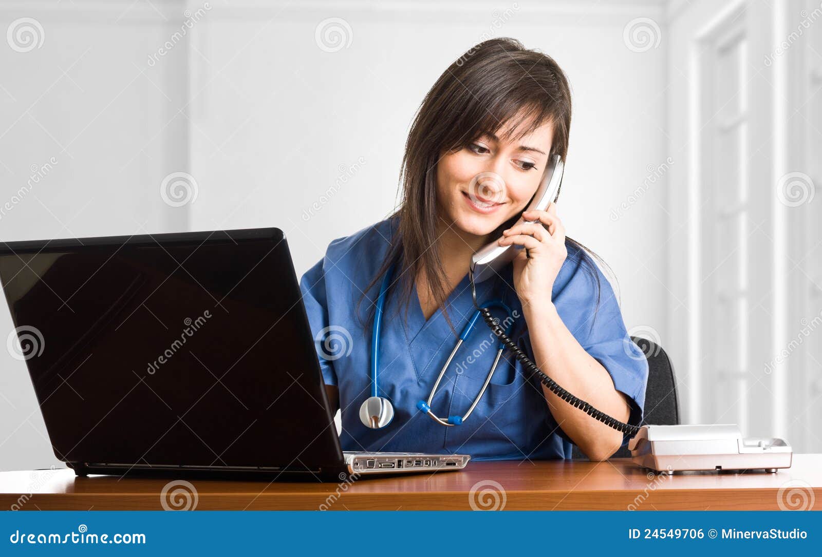 Nurse on the phone stock photo. Image of hispanic, clinic - 24549706