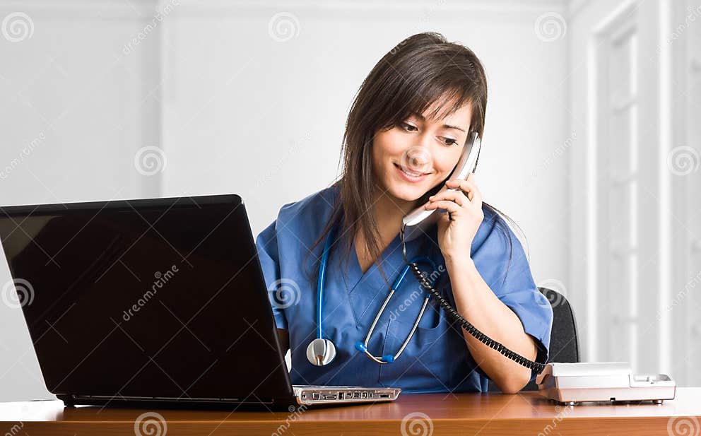 Nurse on the phone stock photo. Image of hispanic, clinic - 24549706