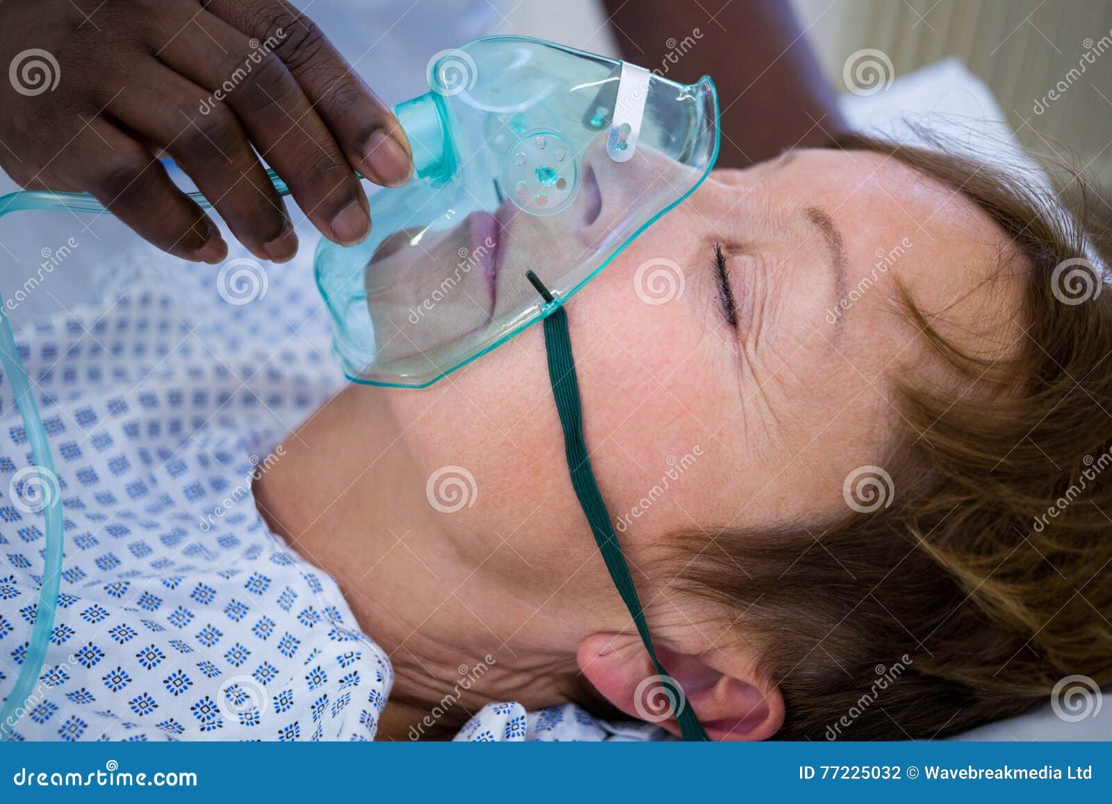 Nurse Placing an Oxygen Mask on the Face of a Patient Stock Photo ...