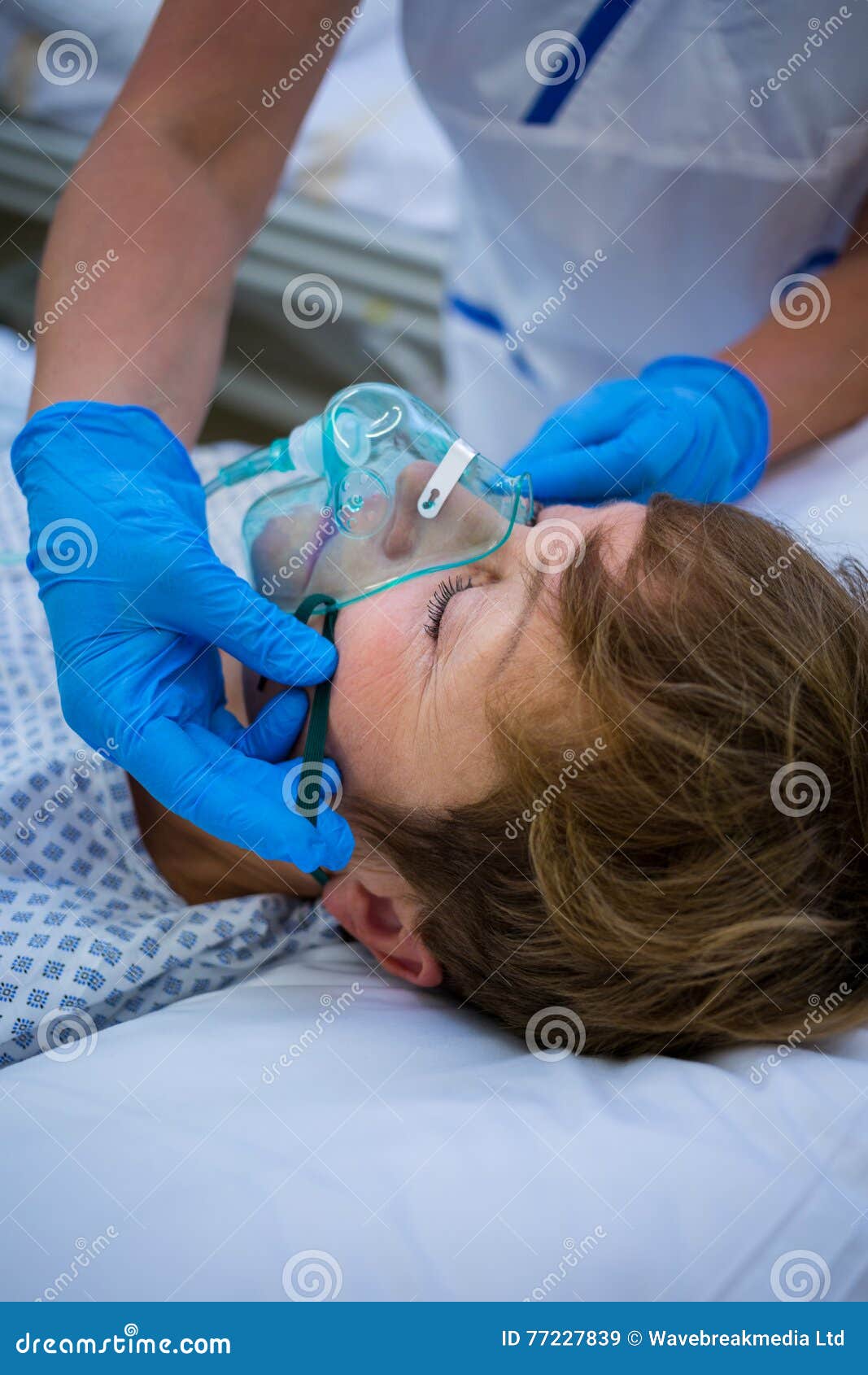 Nurse Placing an Oxygen Mask on the Face of a Patient Stock Image ...
