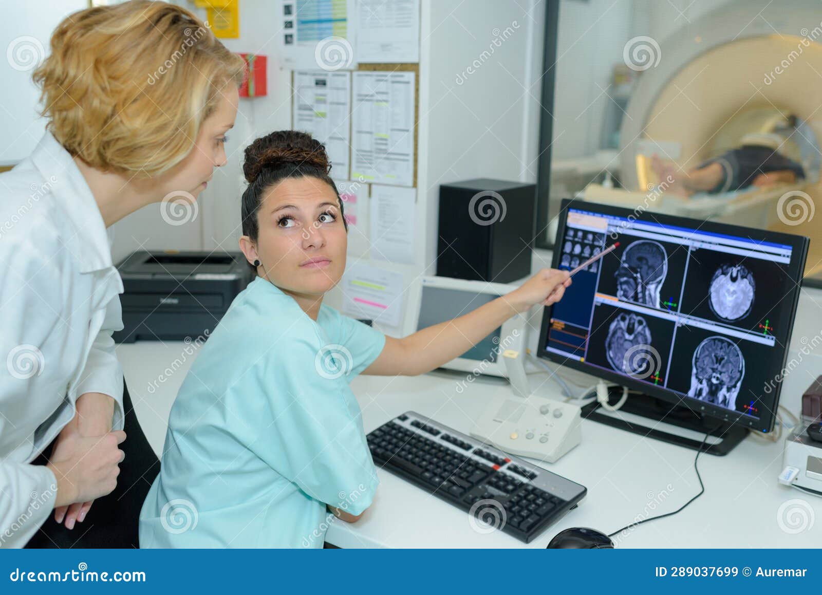 Nurse Pointing at Computer Screen Stock Image - Image of office ...