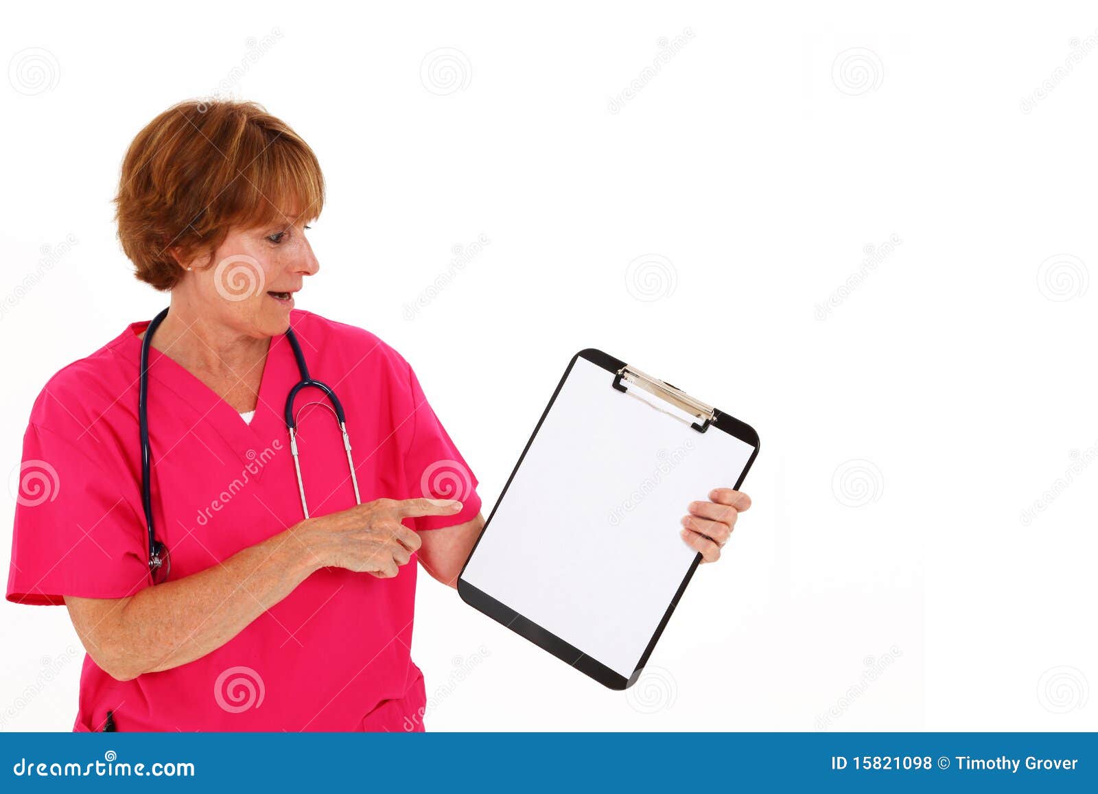 Nurse Pointing To Clipboard Stock Photo - Image of front, aged: 15821098