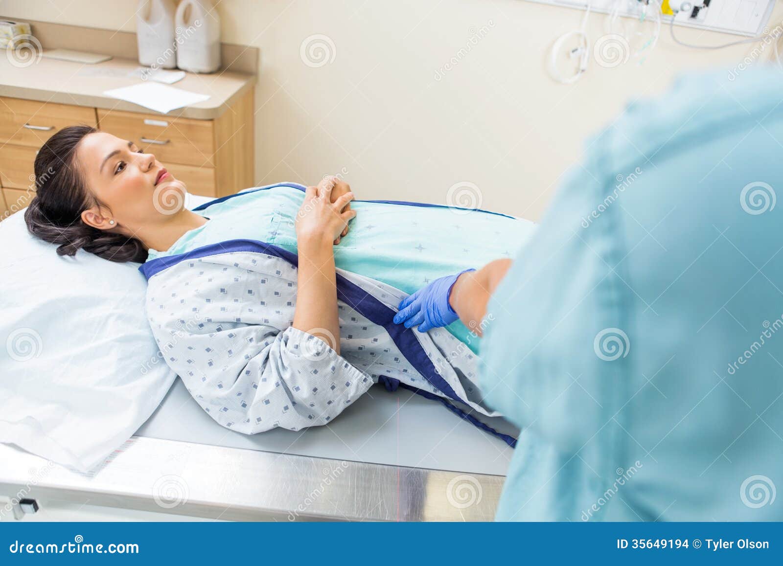 Nurse Preparing Patient in Examination Room Stock Photo - Image of ...