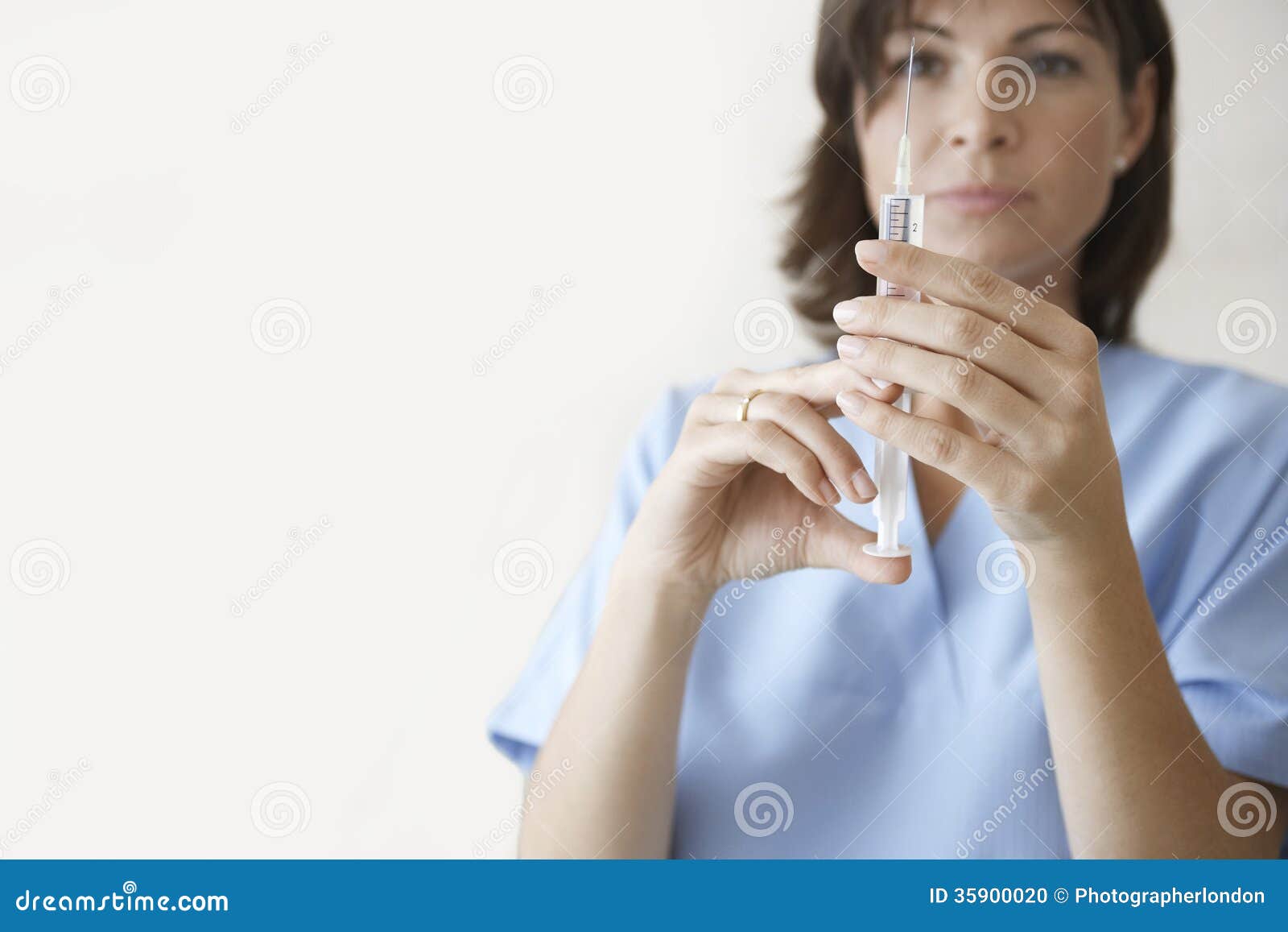 Nurse Preparing Syringe for Injection Focus on Syringe Stock Photo ...