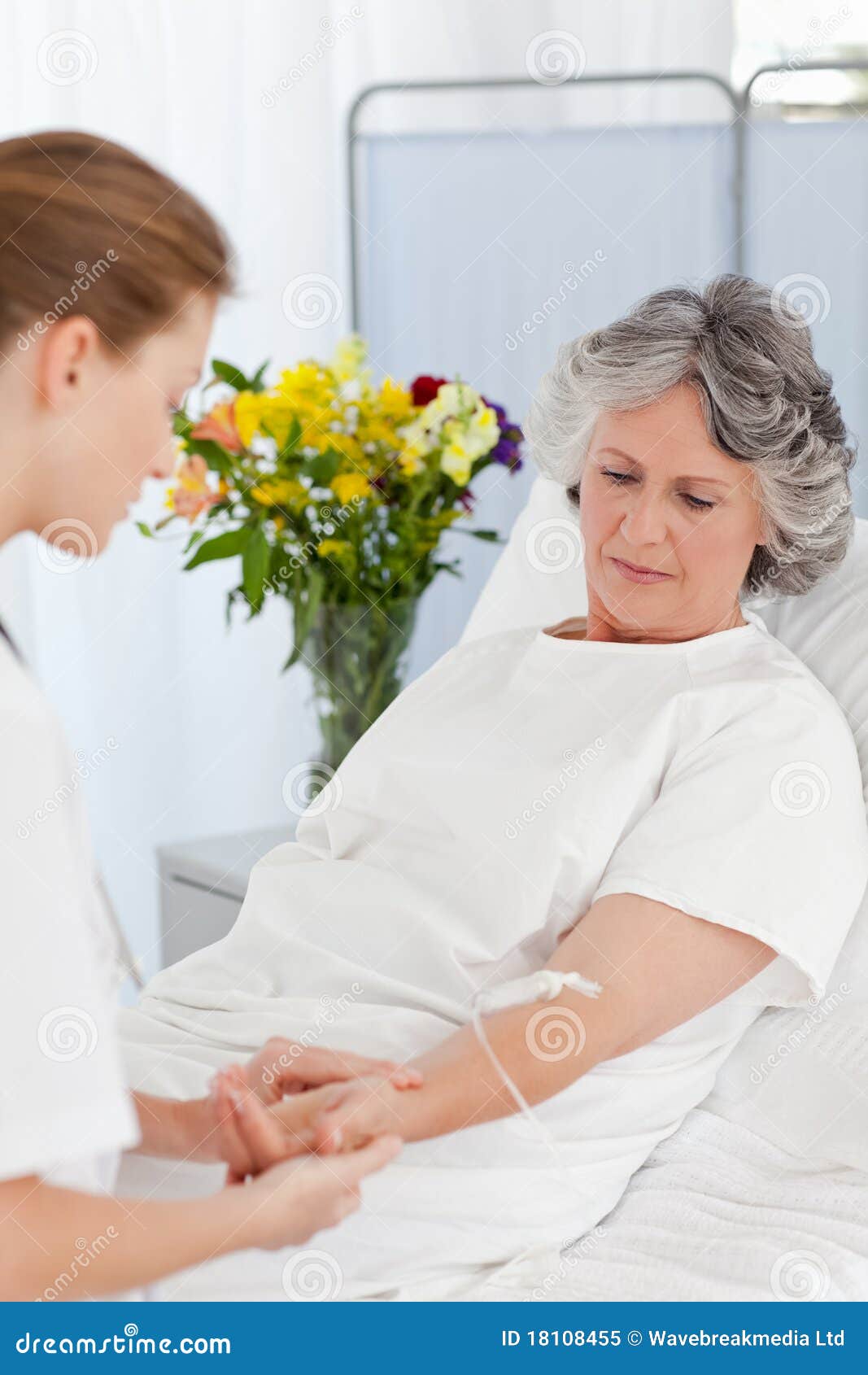 Nurse Putting a Drip on the Arm of Her Patient Stock Image - Image of ...