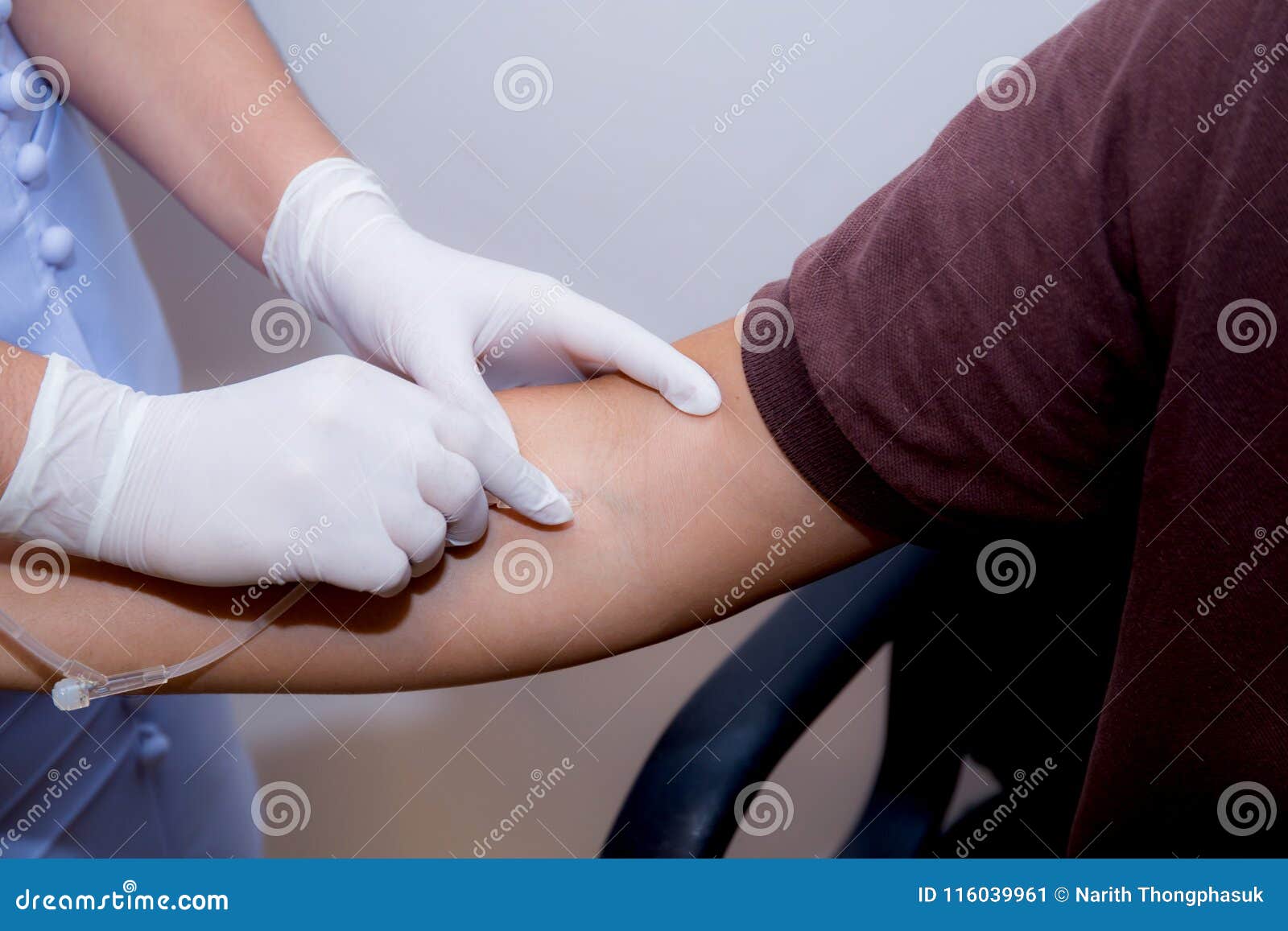 Nurse Putting an IV Needle into a Patients Hand. Stock Image - Image of ...