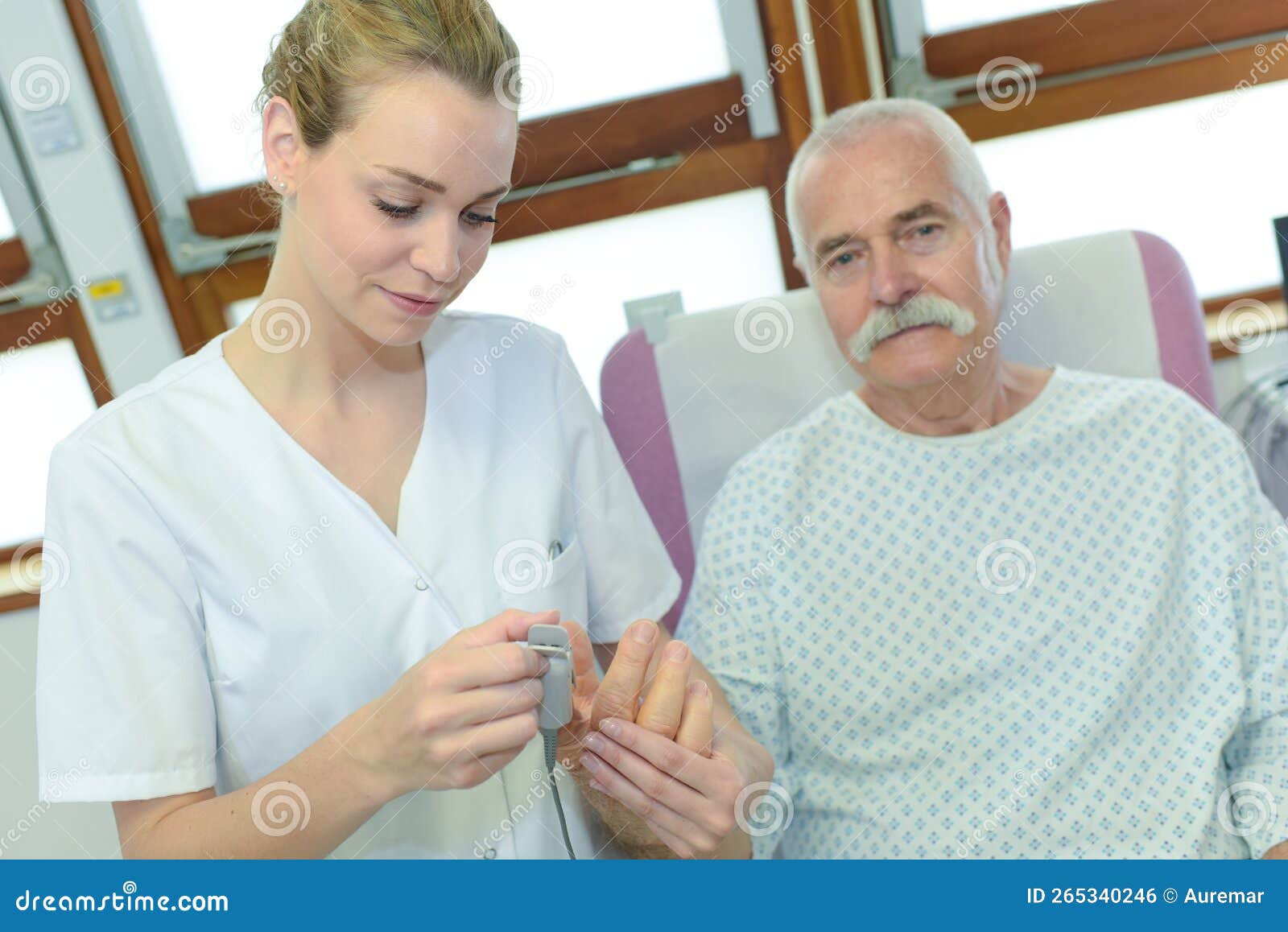 Nurse Putting Pulse Reader on To Patients Finger Stock Photo - Image of ...