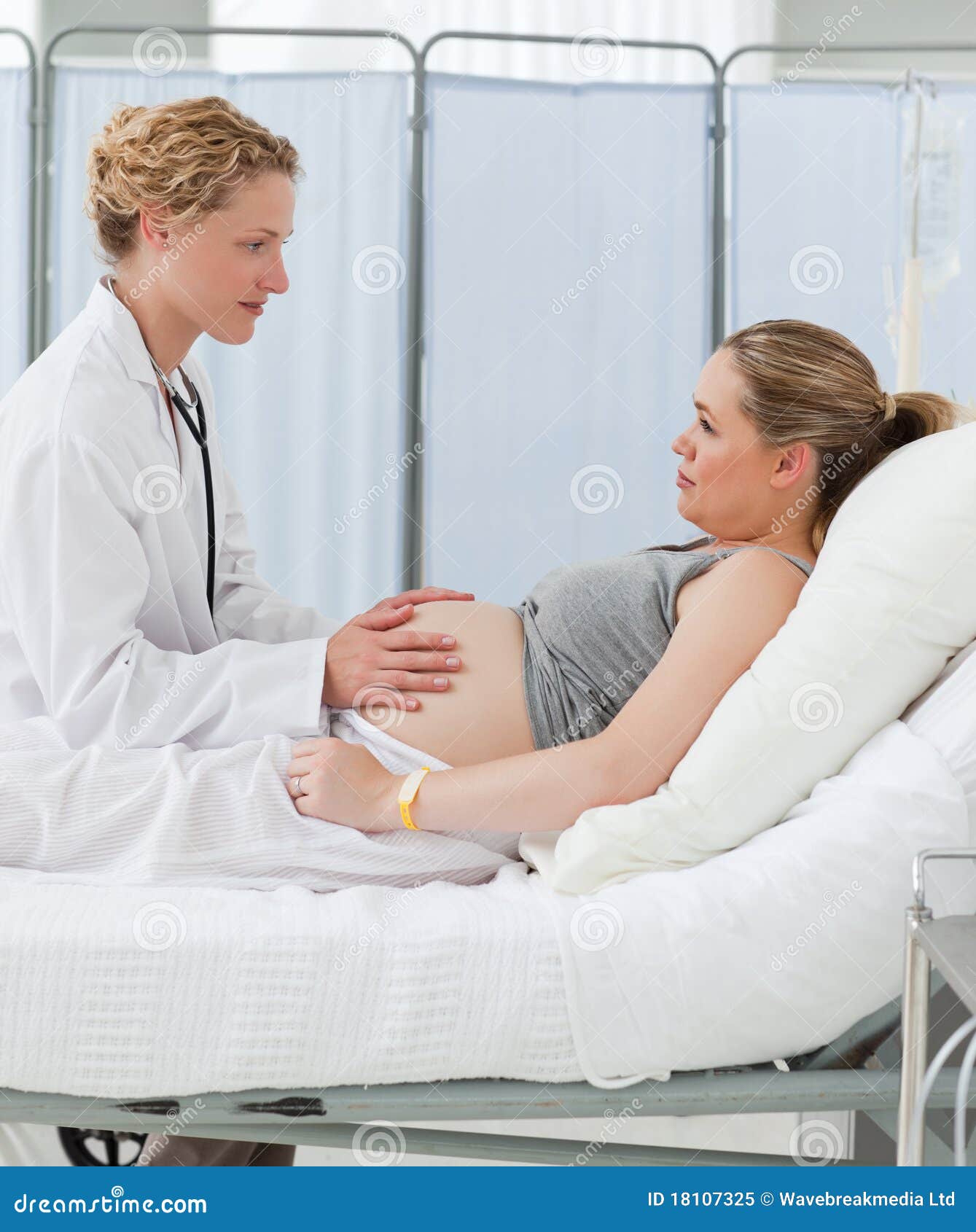 Nurse Reassuring Her Pregnant Patient Stock Image - Image of enjoyment ...