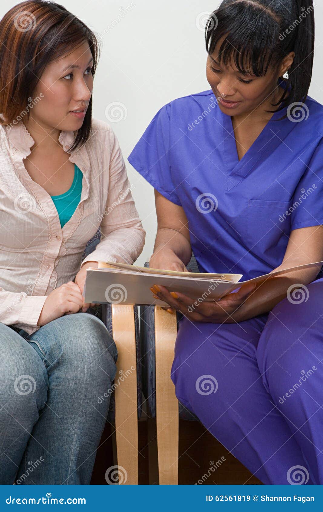 Nurse Sharing Information with Patient Stock Image - Image of african ...