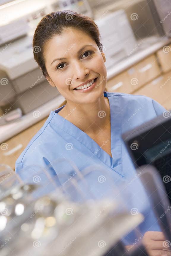 A Nurse Sitting at a Computer Stock Photo - Image of adult, caucasian ...