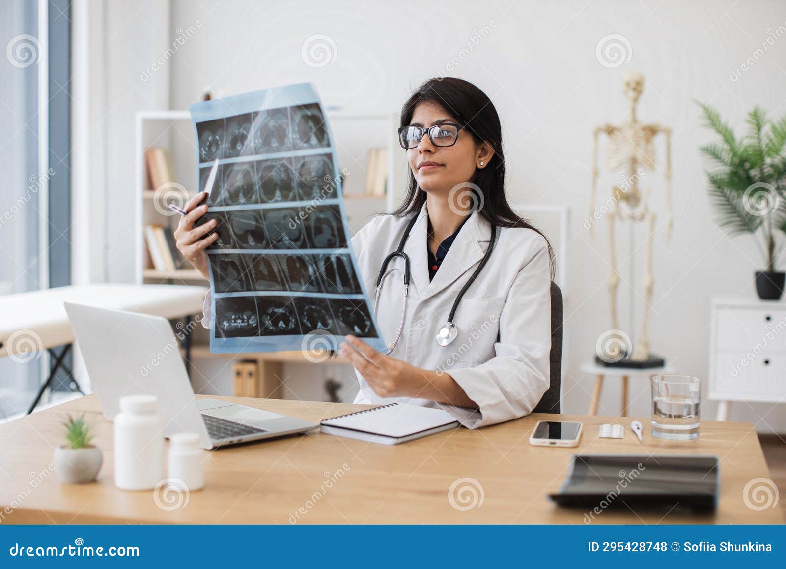 Nurse Studying CT Brain Scans in Doctor& X27;s Office Interior Stock ...