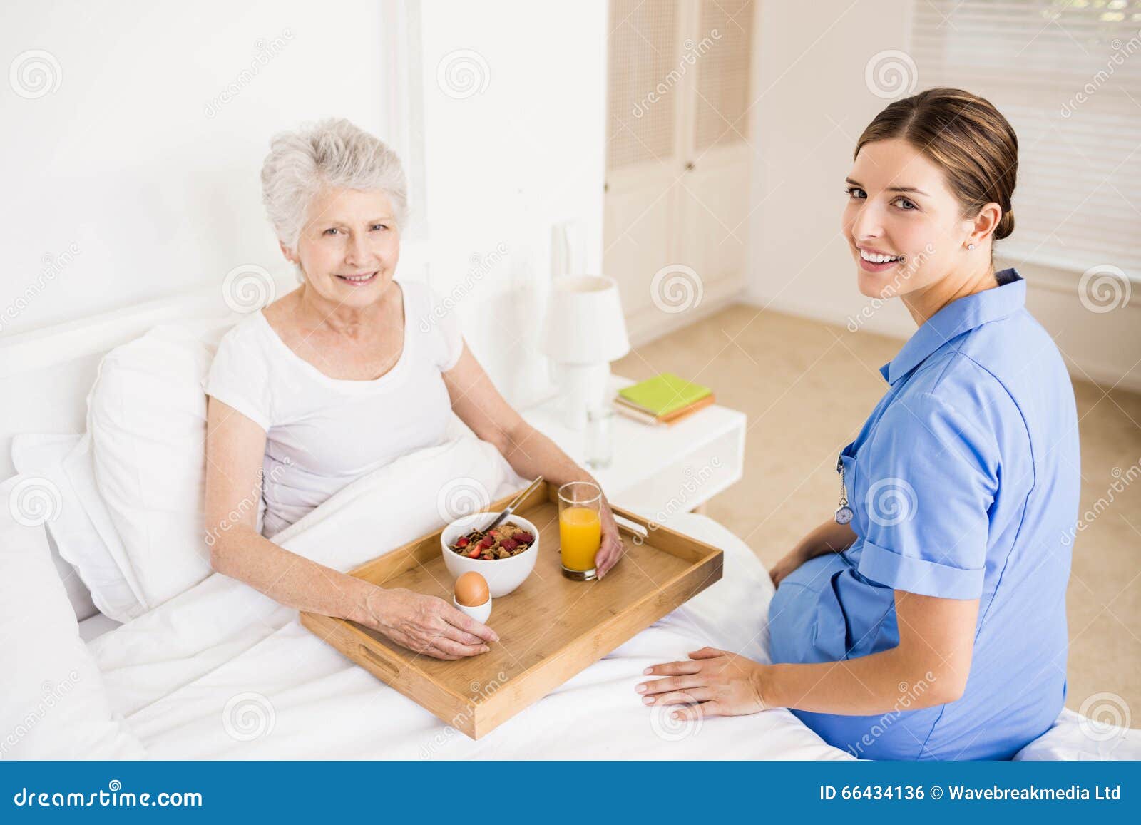 Nurse Taking Care of Suffering Senior Patient Stock Photo - Image of ...