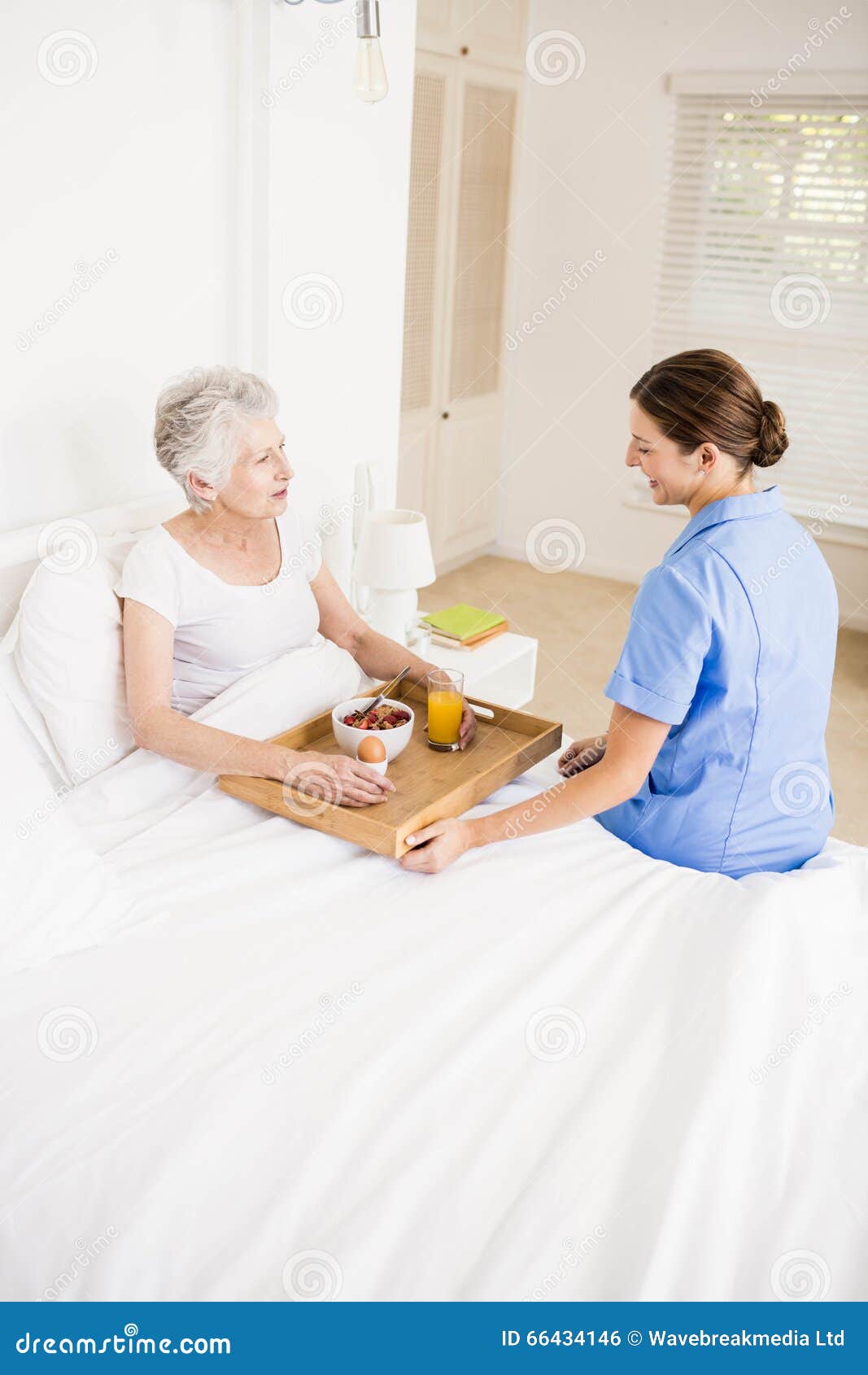 Nurse Taking Care of Suffering Senior Patient Stock Photo - Image of ...