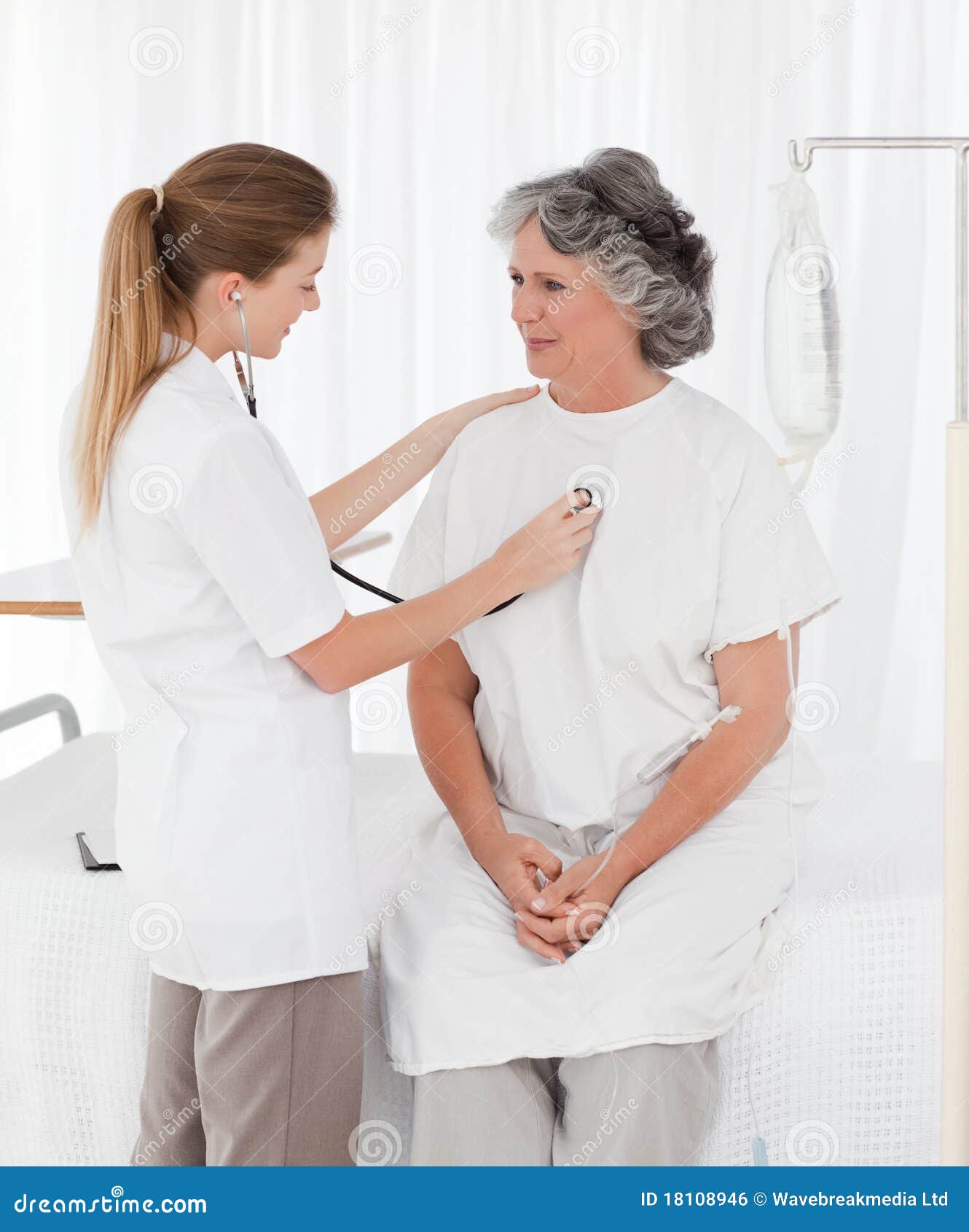 Nurse Taking the Heartbeat of Her Patient Stock Photo - Image of ...