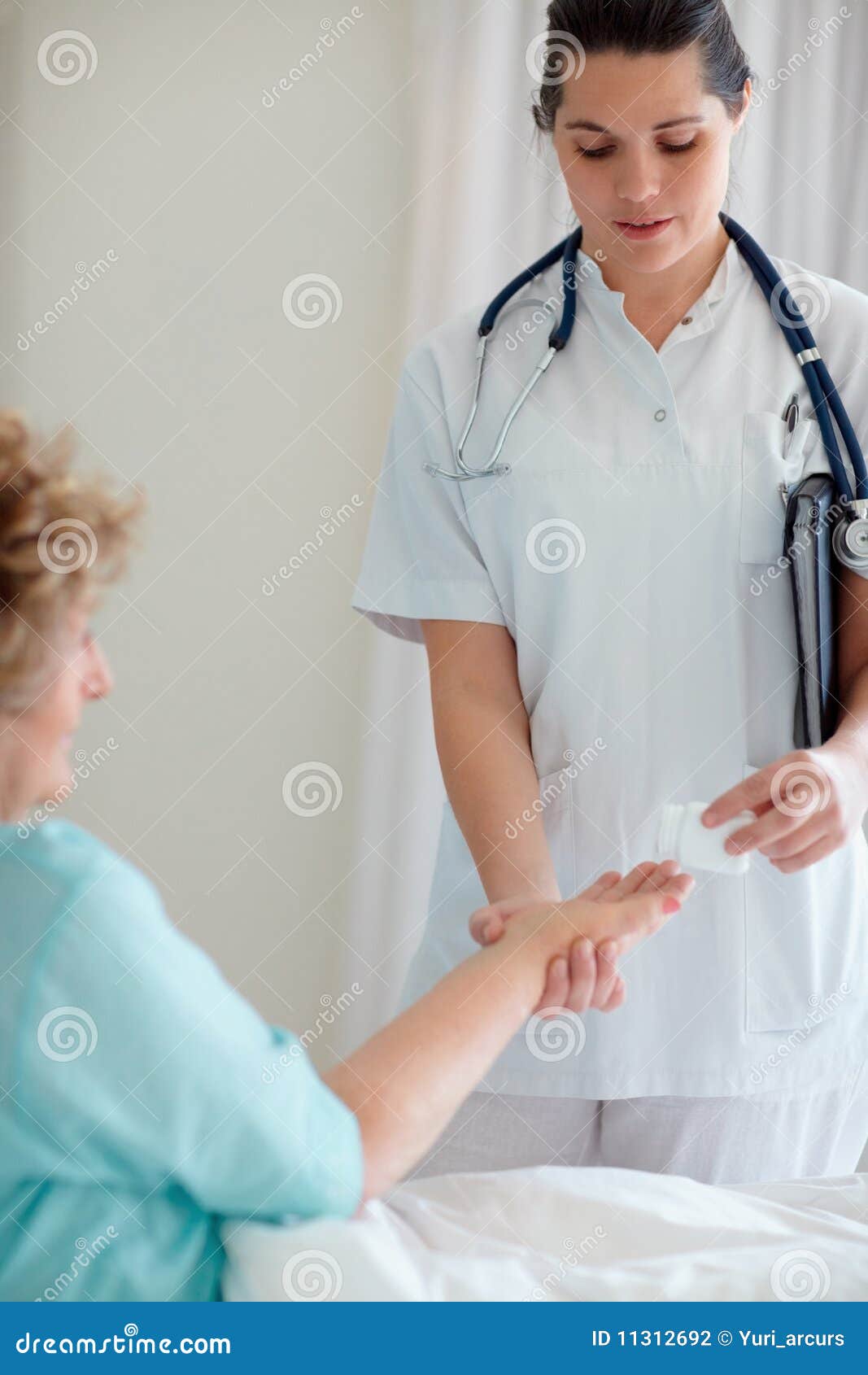 Nurse Treating an Elderly Patient of a Sickness Stock Photo - Image of ...