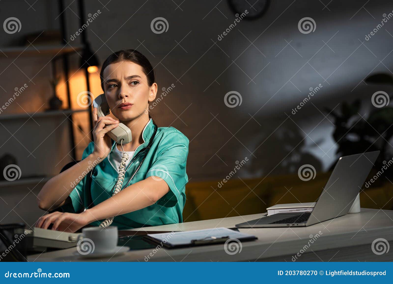 Nurse in Uniform Sitting at Table Stock Photo - Image of attractive ...