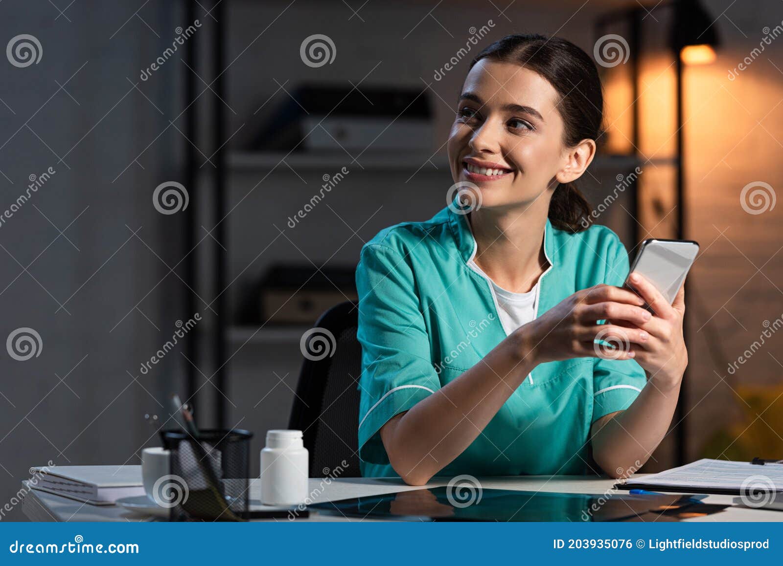 Nurse in Uniform Sitting at Table Stock Photo - Image of nurse, happy ...