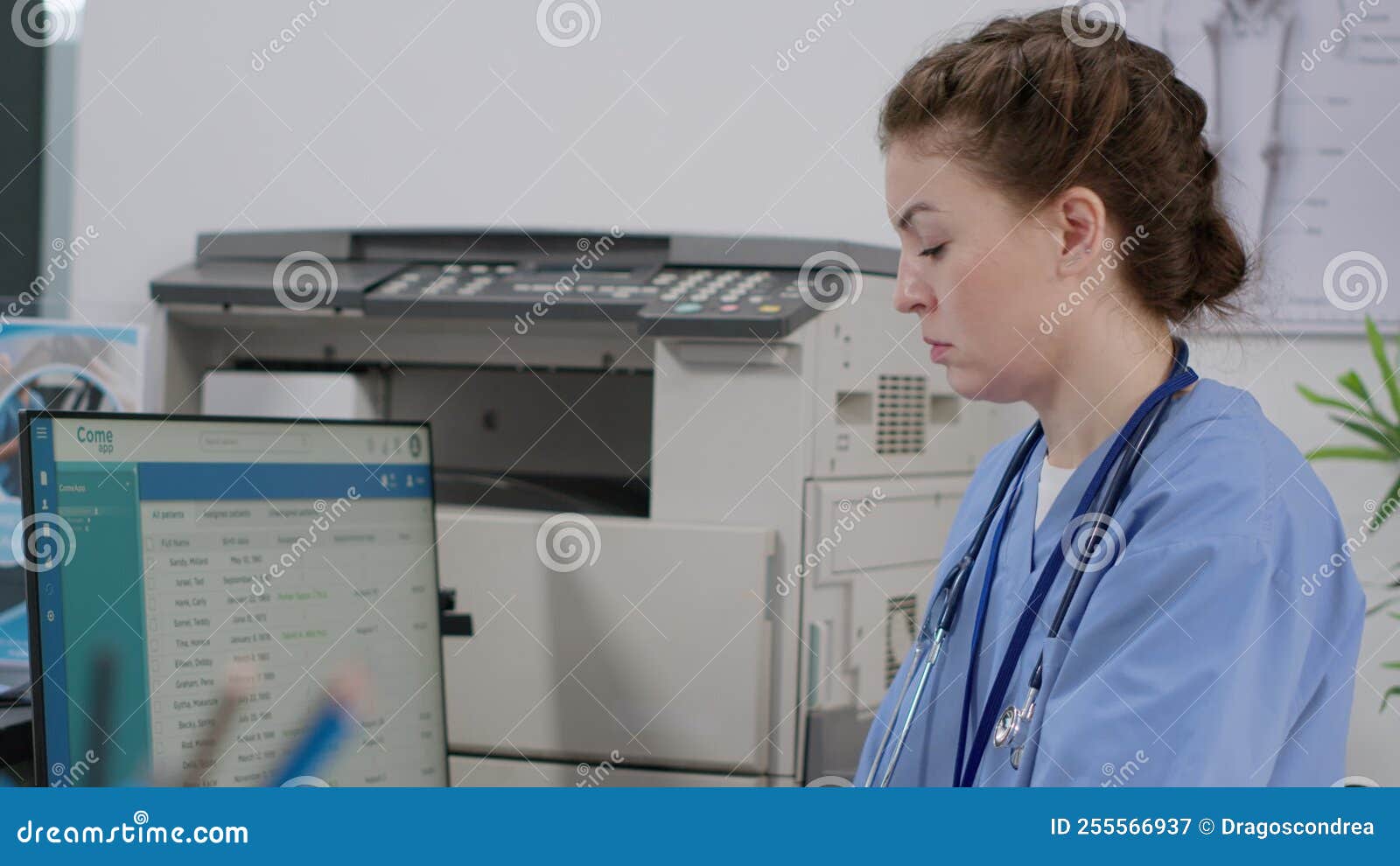Nurse Using Computer with Appointments at Reception Desk Stock Video ...