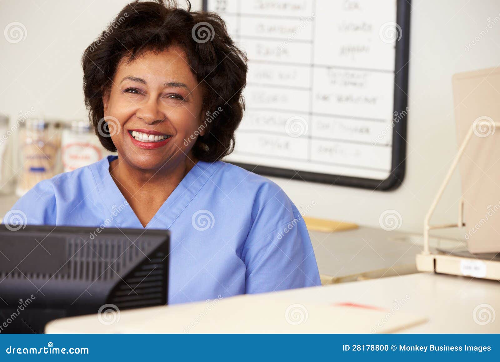 Nurse Using Computer at Nurses Station Stock Photo - Image of american ...