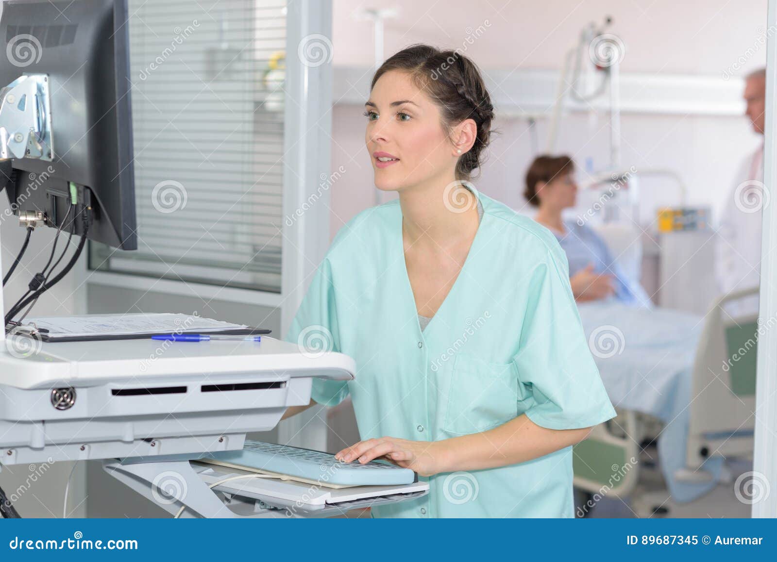 Nurse Using Computer Outside Patient`s Room Stock Image - Image of ...