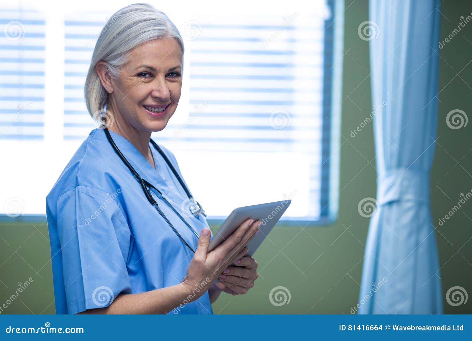 Nurse using digital tablet stock photo. Image of internet - 81416664
