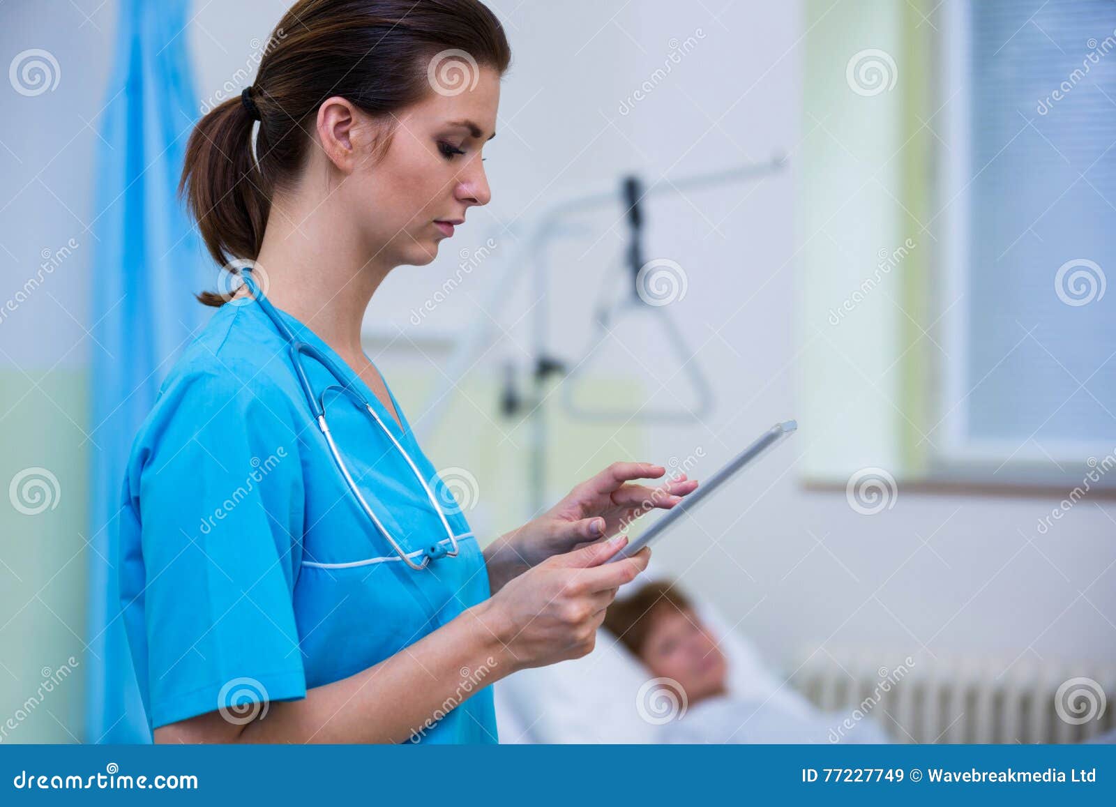 Nurse Using Digital Tablet in Hospital Ward Stock Image - Image of ...