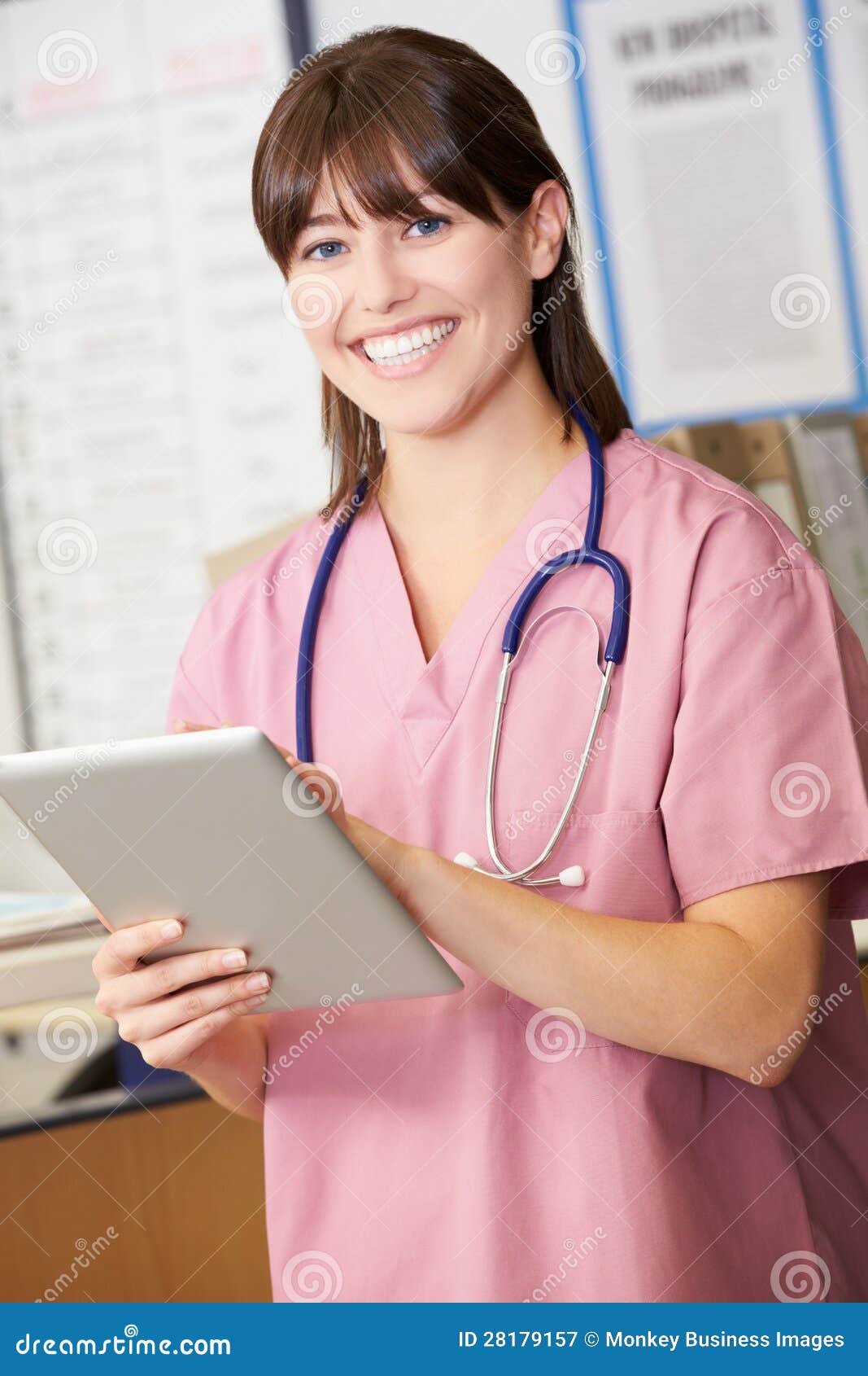 Nurse Using Digital Tablet at Nurses Station Stock Image - Image of ...