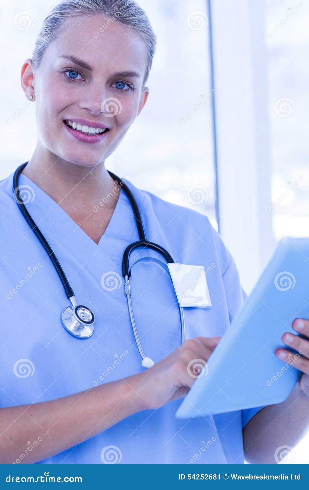 Nurse using her tablet pc stock image. Image of care - 54252681