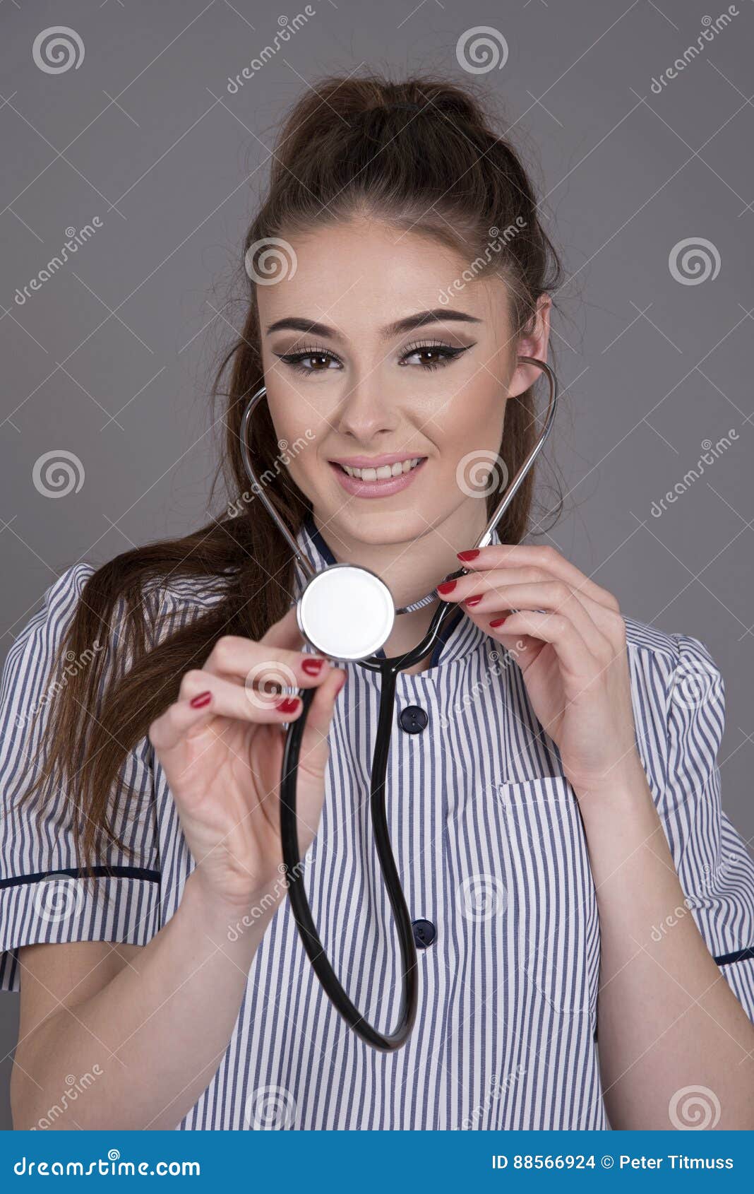 Nurse using a stethoscope stock photo. Image of female - 88566924