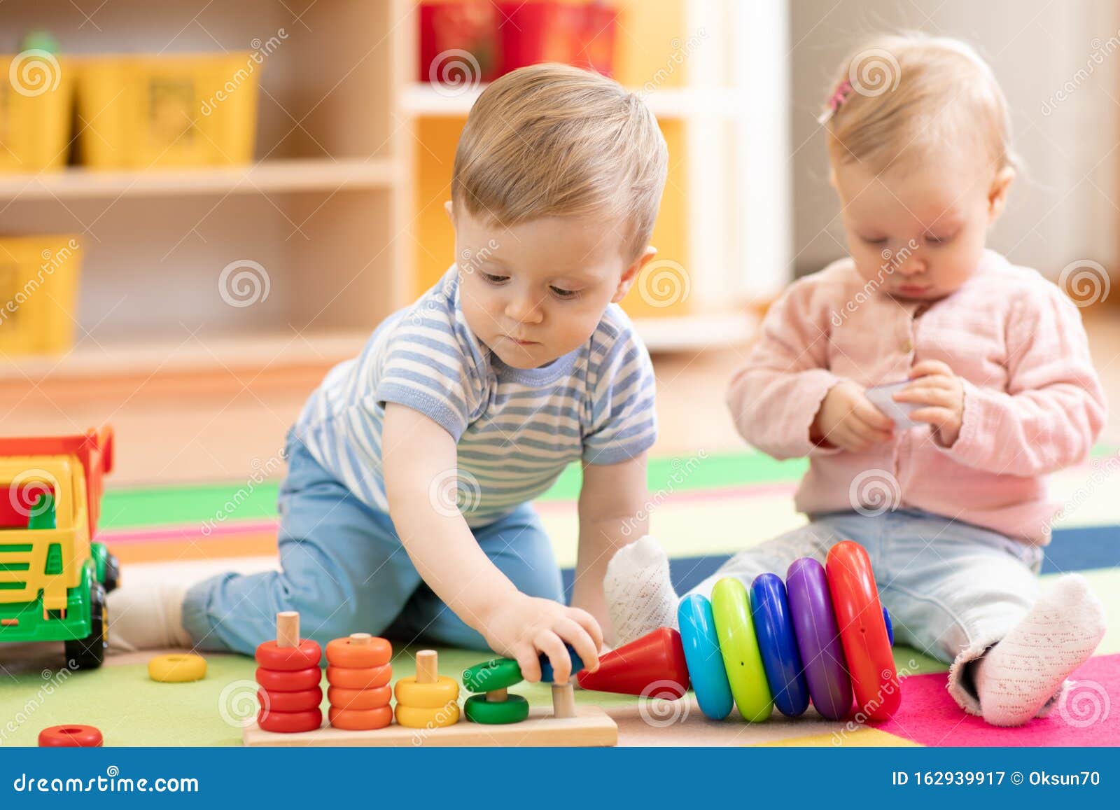 Nursery Babies Playing with Educational Toys, Early Learning Stock ...