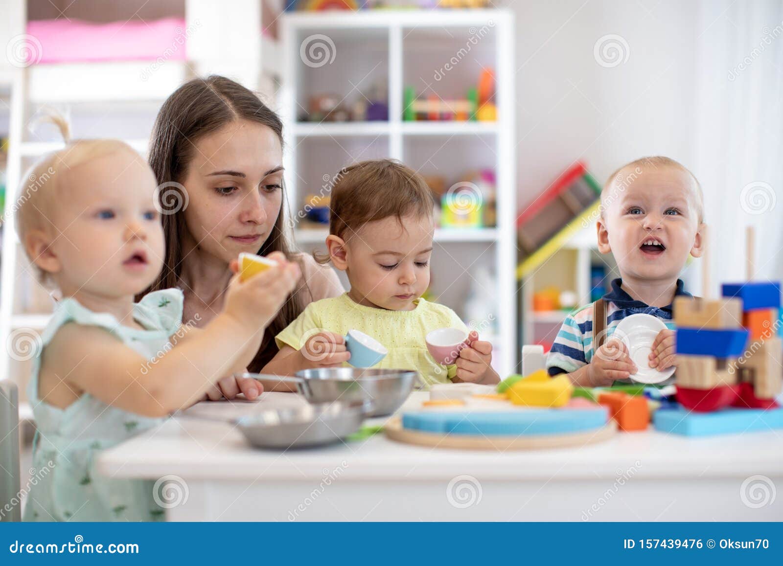 Nursery Children Playing with Teacher in the Classroom Stock Photo ...