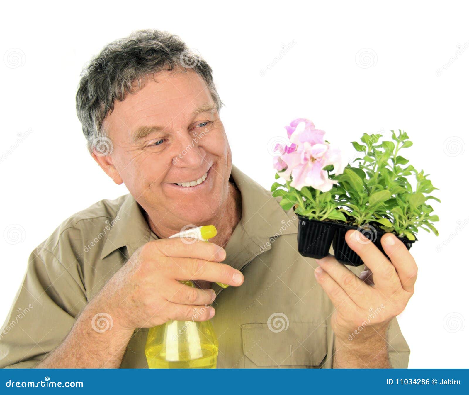 Nurseryman Sprays Seedlings Stock Photo - Image of tending, bottle ...